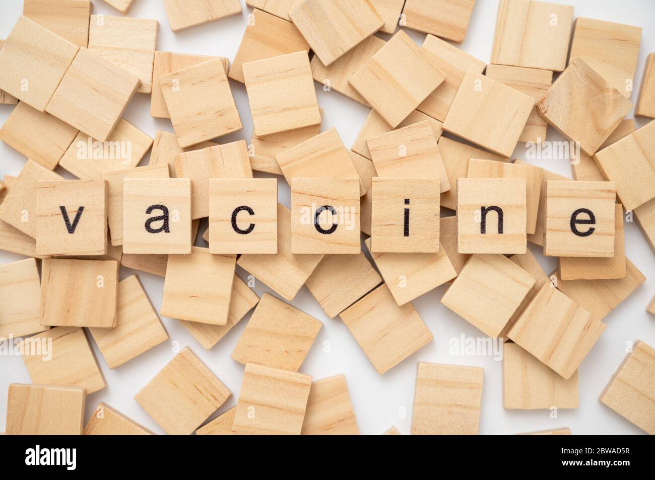 Wooden letter tiles spelling the word VACCINE Stock Photo - Alamy