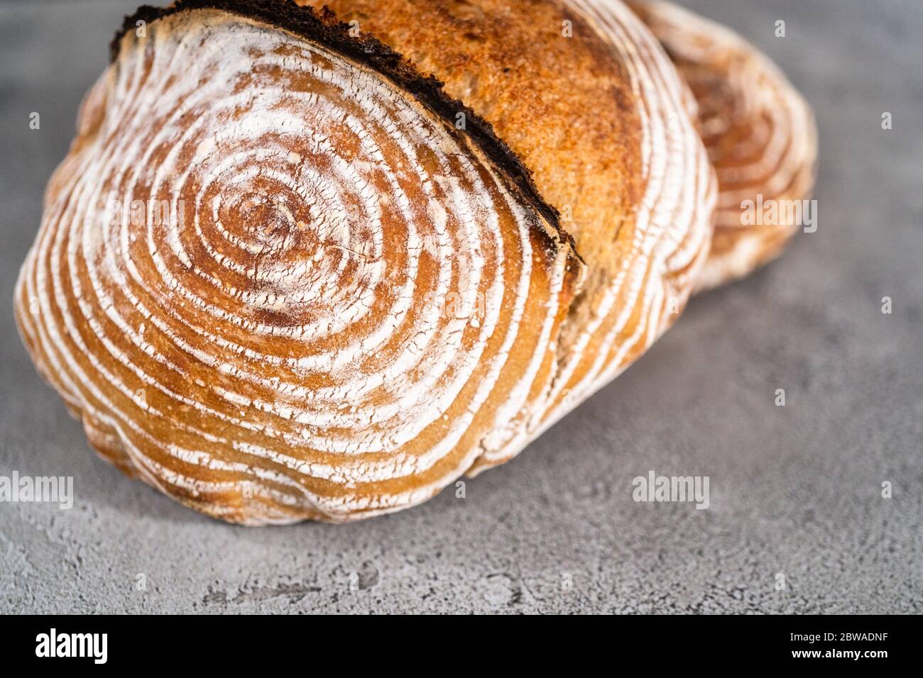 Freshly baked loaf of a wheat sourdough bread with marks from bread ...