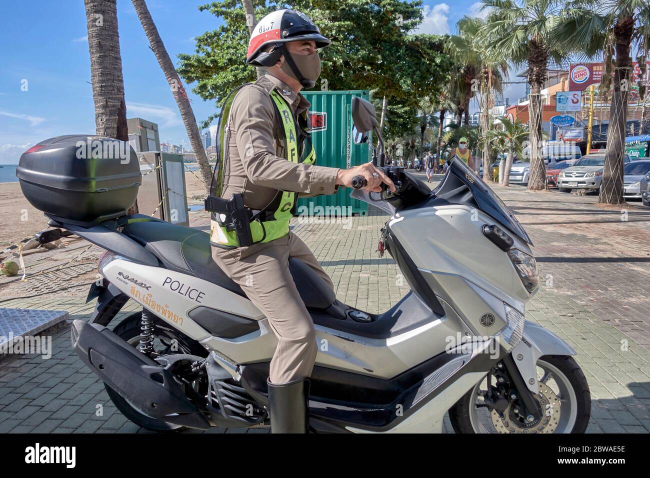 Thailand police officer. Asian policeman and motorcycle Stock Photo - Alamy