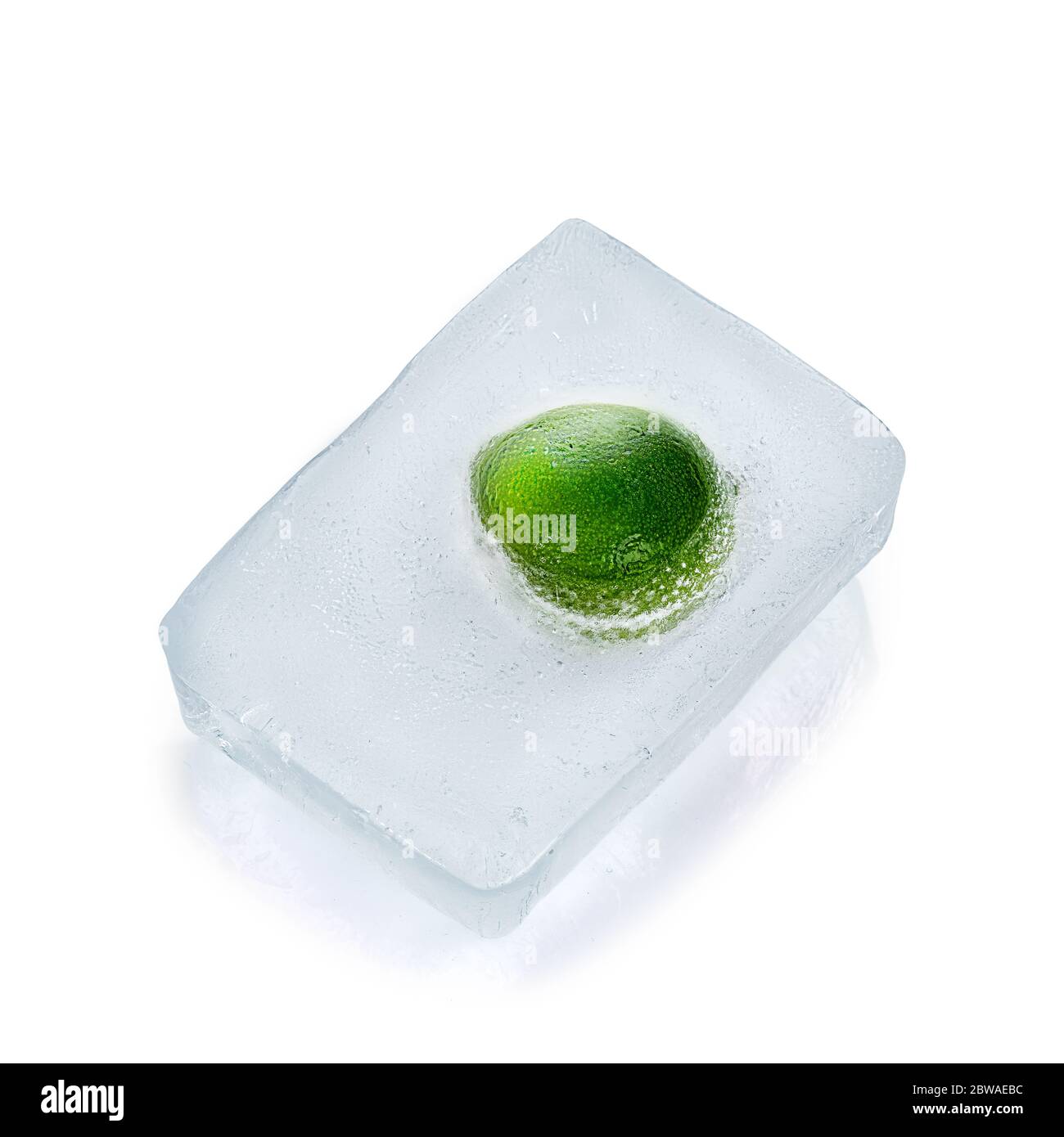Fresh lime frozen in ice isolated on white background Stock Photo - Alamy
