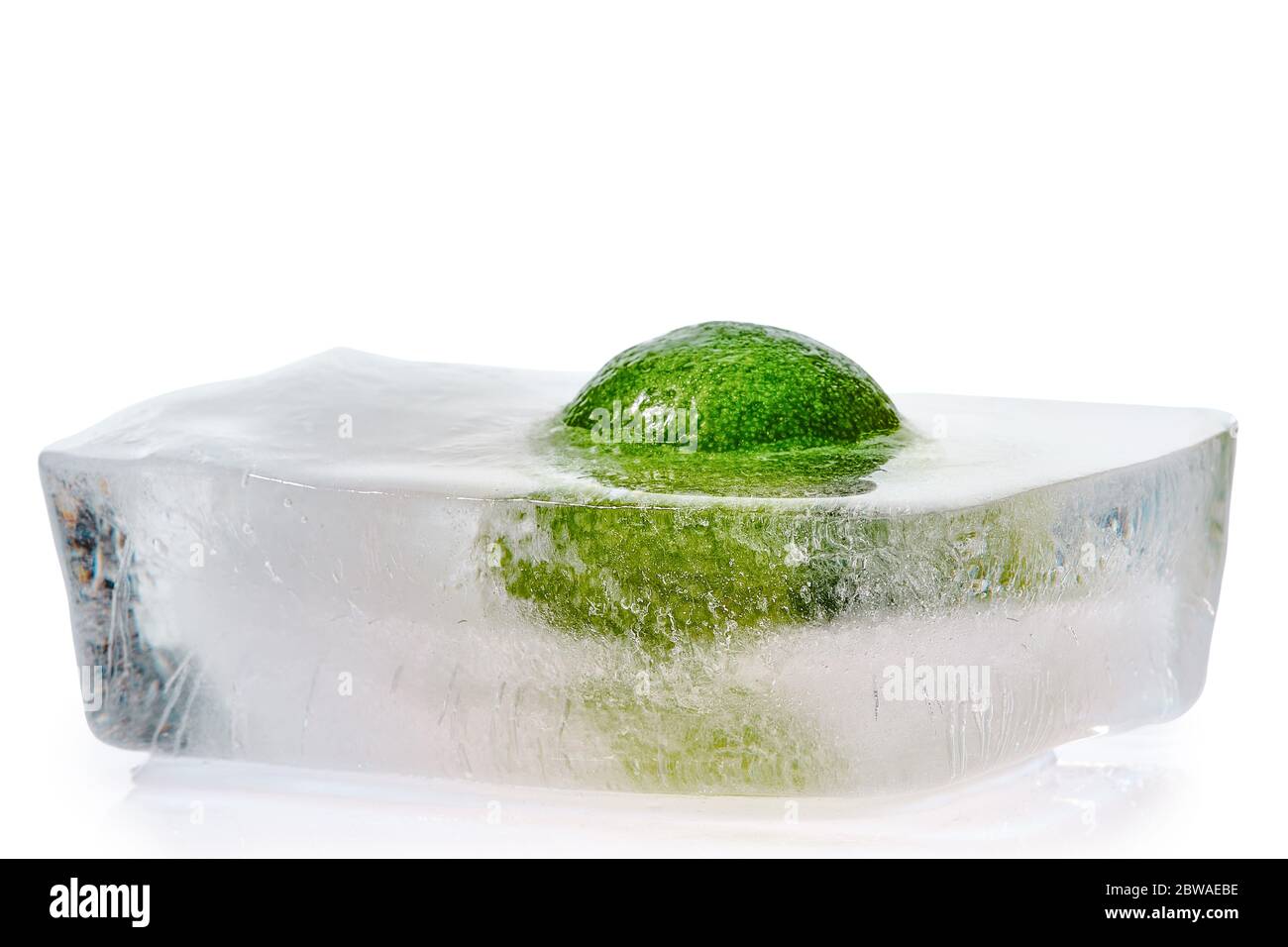 Fresh lime frozen in ice isolated on white background Stock Photo - Alamy