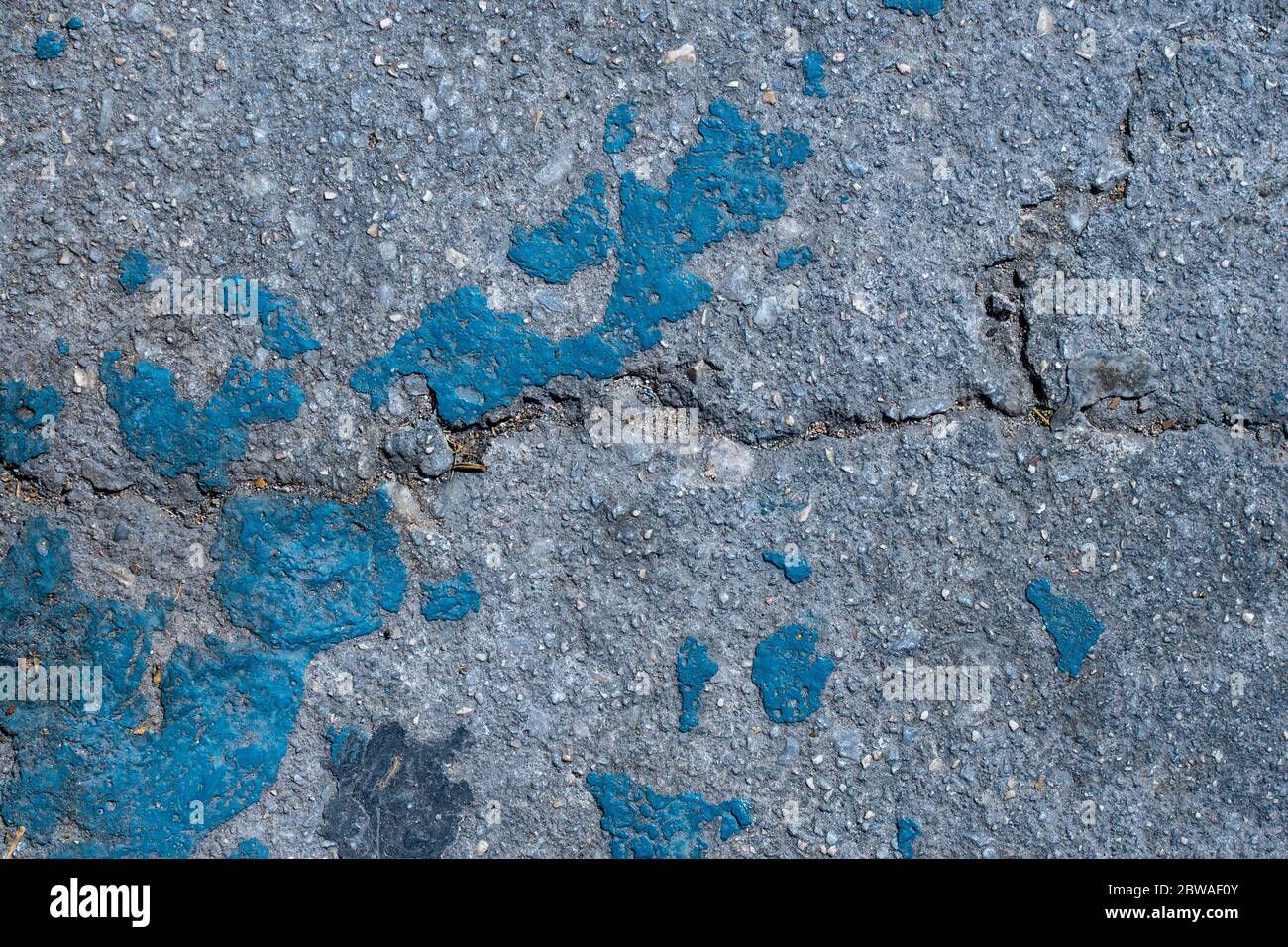 Asphalt road texture with worn blue paint. Close-up. Top view Stock ...