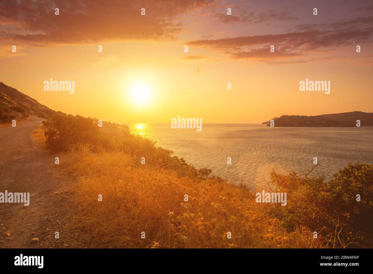 Sunrise on the island of Crete near Spinalonga with sea coast, rocks ...