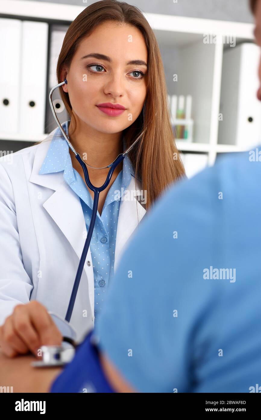 Beautiful female doctor make medic procedure portrait Stock Photo - Alamy