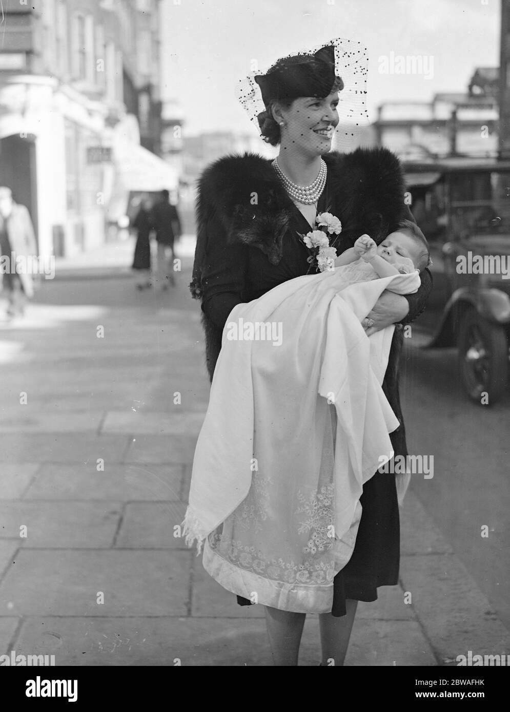 Woman holds baby Black and White Stock Photos & Images - Alamy
