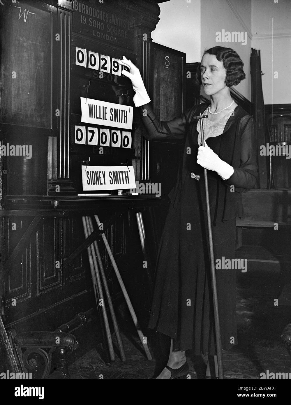 Mrs Ruth Harrison of Newcastle , acts as marker in the billiards match ...