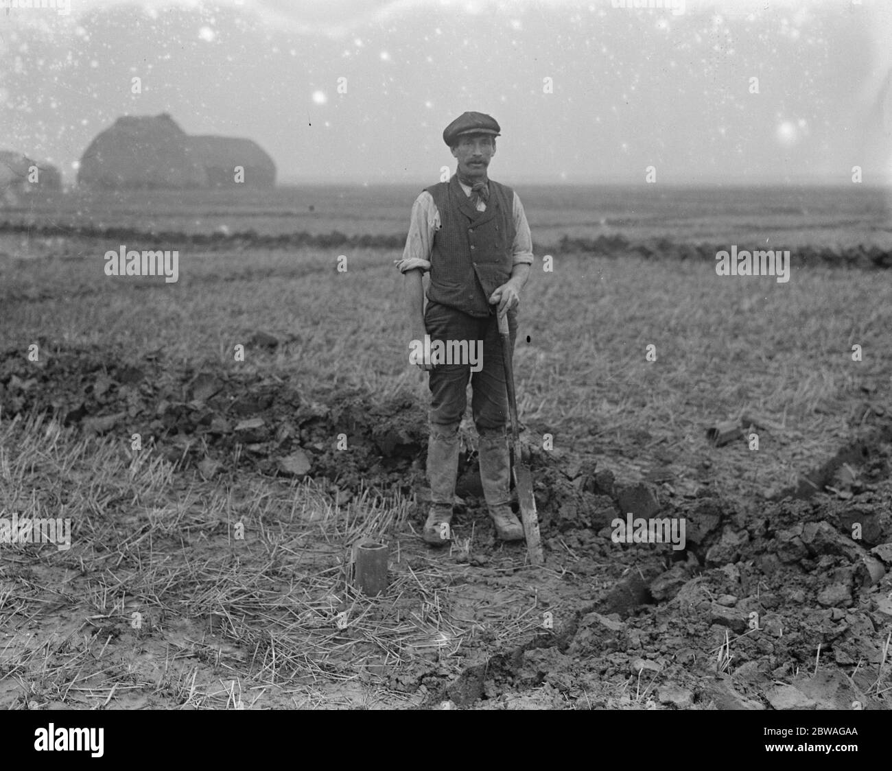 A man digging peat for fuel in Lincolnshire Stock Photo - Alamy