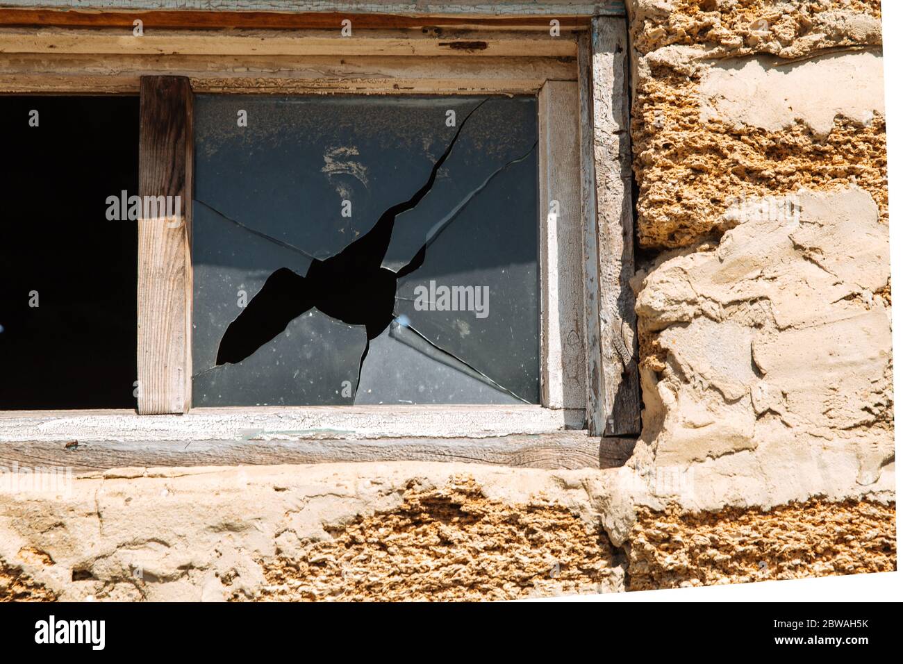 Broken glass in a building window. Housing problems Stock Photo - Alamy