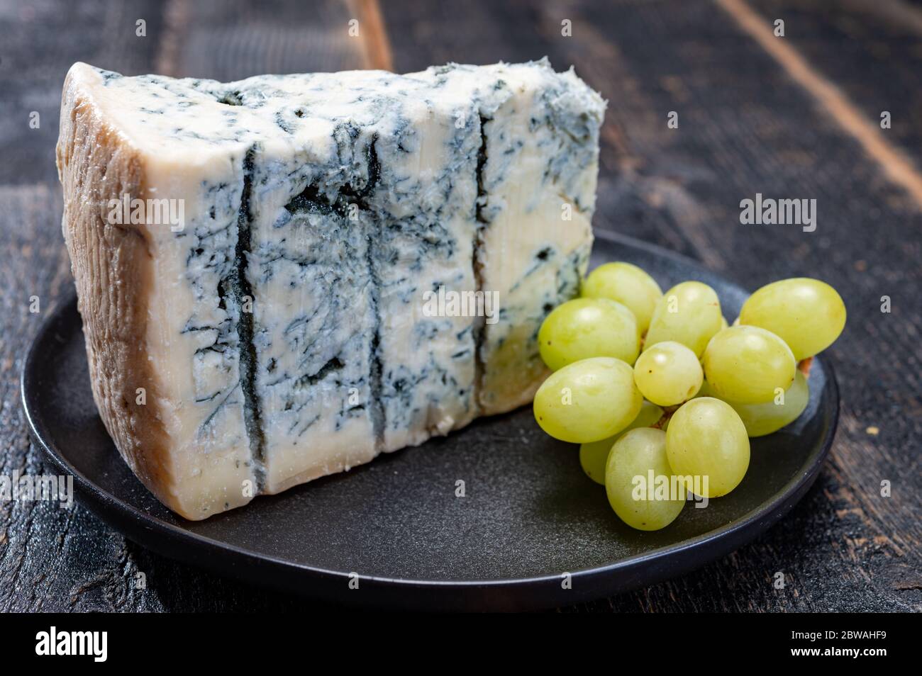 Cheese collection, piece of italian blue cheese gorgonzola picante with ...