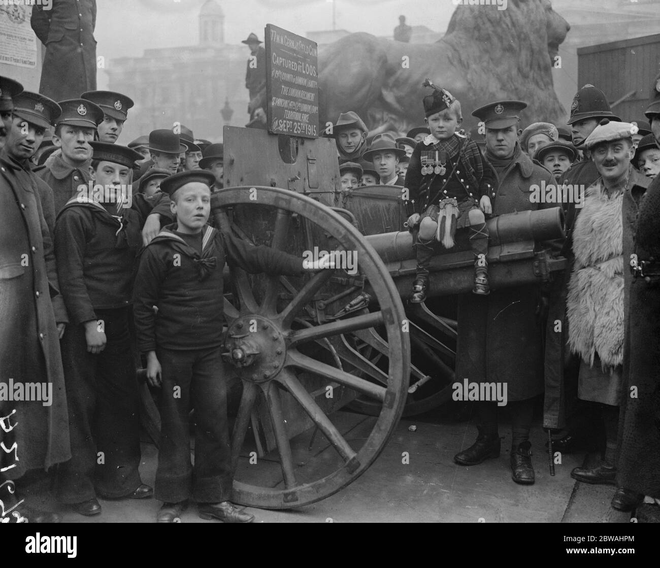A German gun ( 77mm Feld Kanone (field gun) ) captured at Loos , at a ...