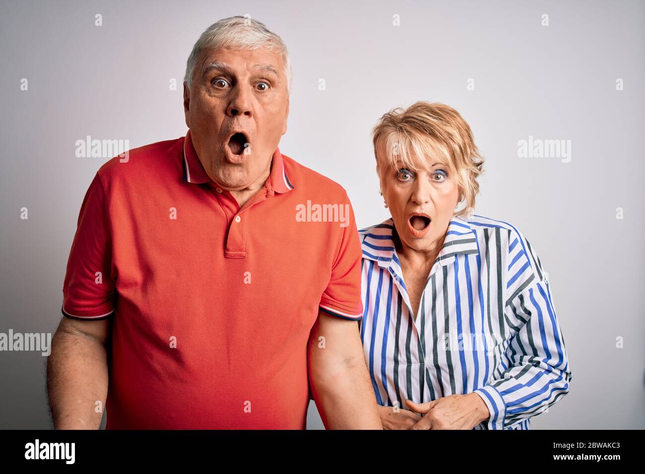 Senior beautiful couple standing together over isolated white ...