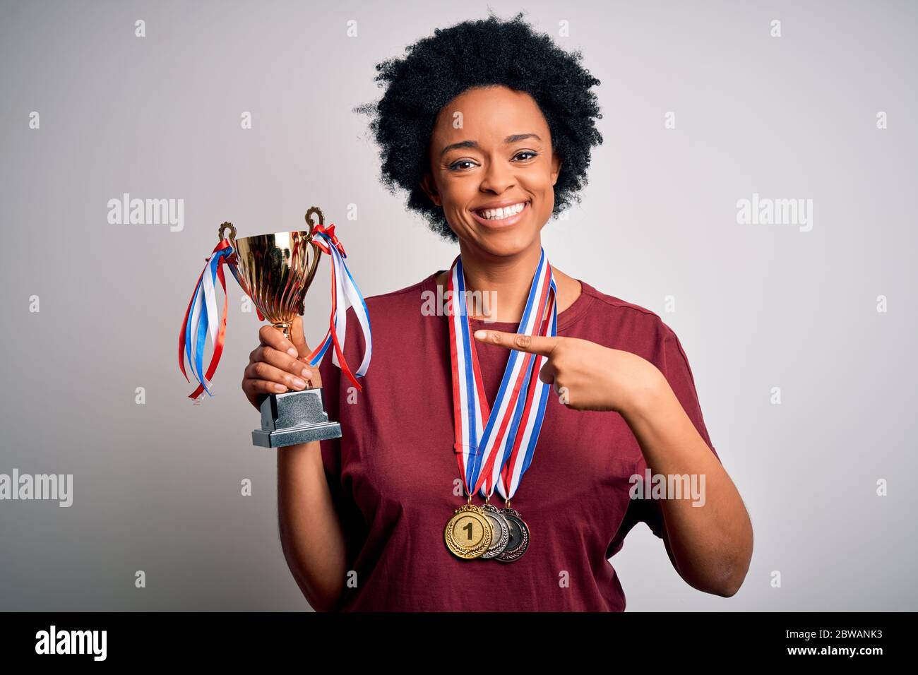 Young African American afro athlete woman with curly hair wearing ...
