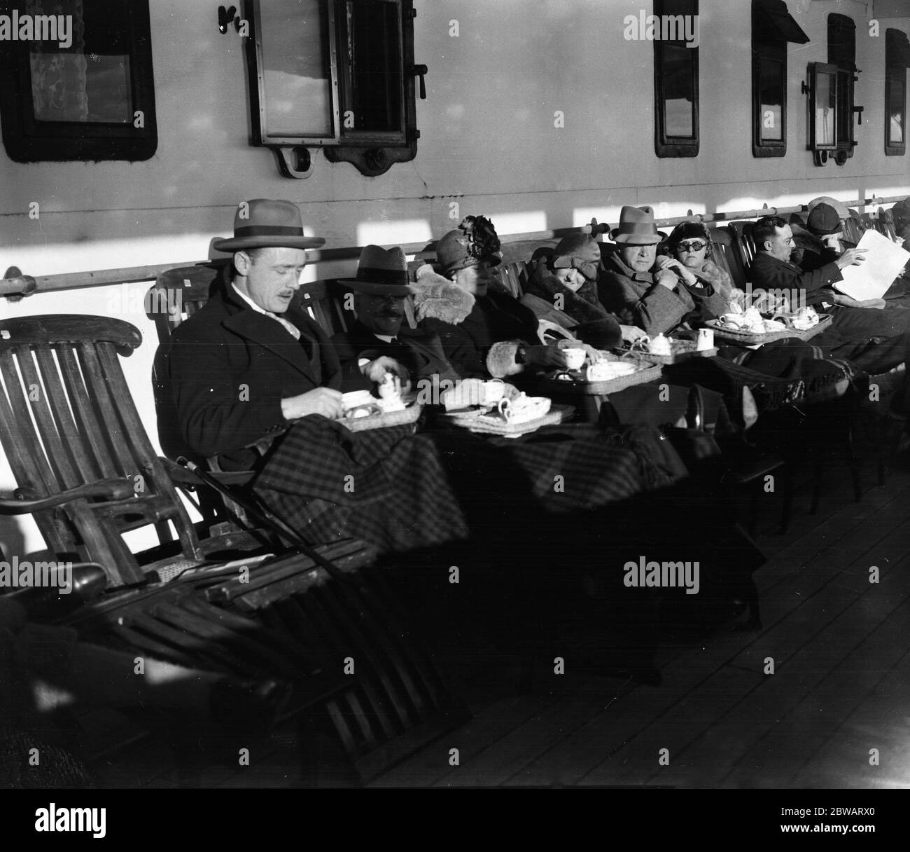 Passengers enjoy some tea on deck aboard the ocean liner , RMS Adriatic ...