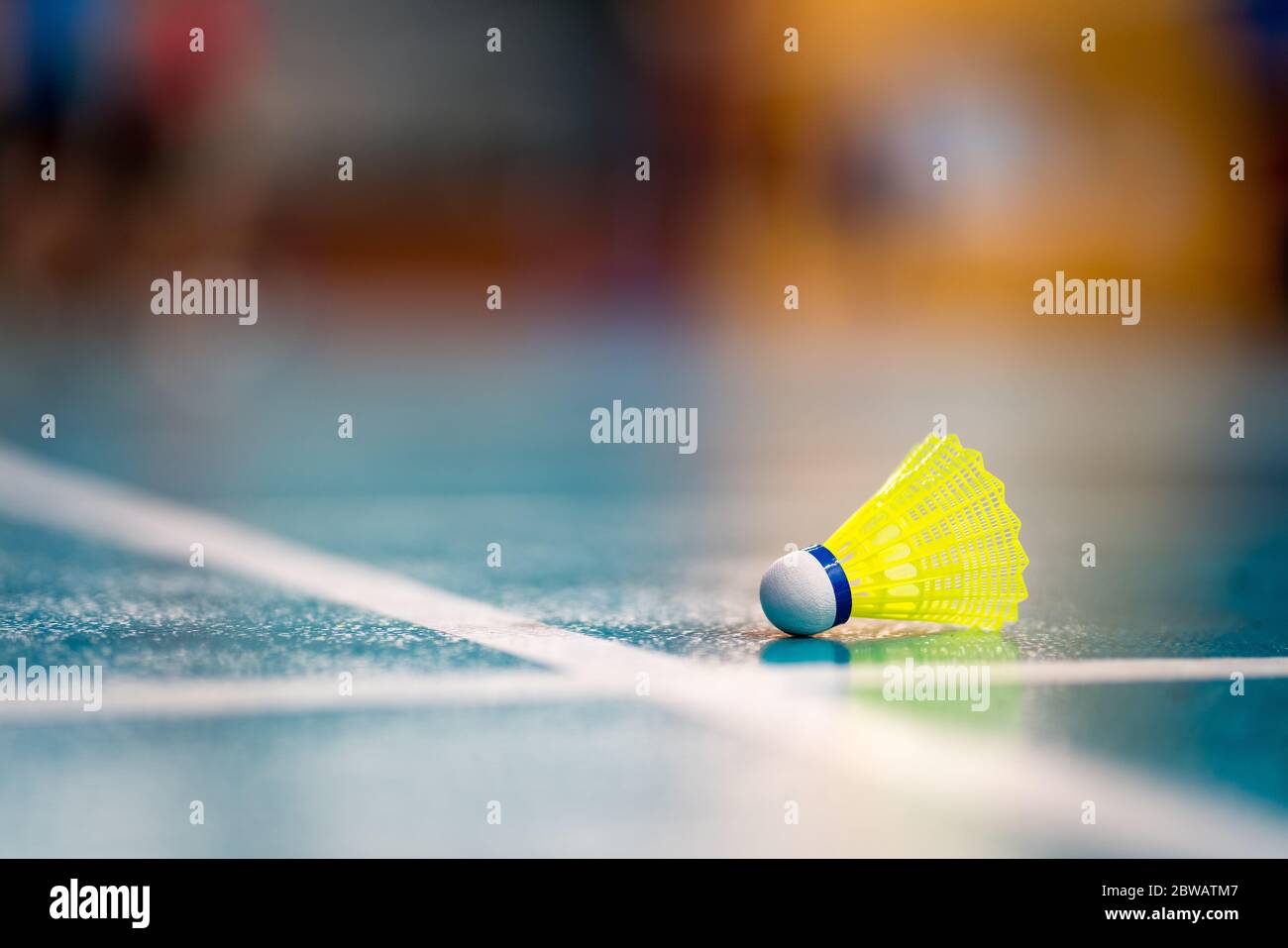 Badminton yellow shuttlecock on the green floor Stock Photo - Alamy