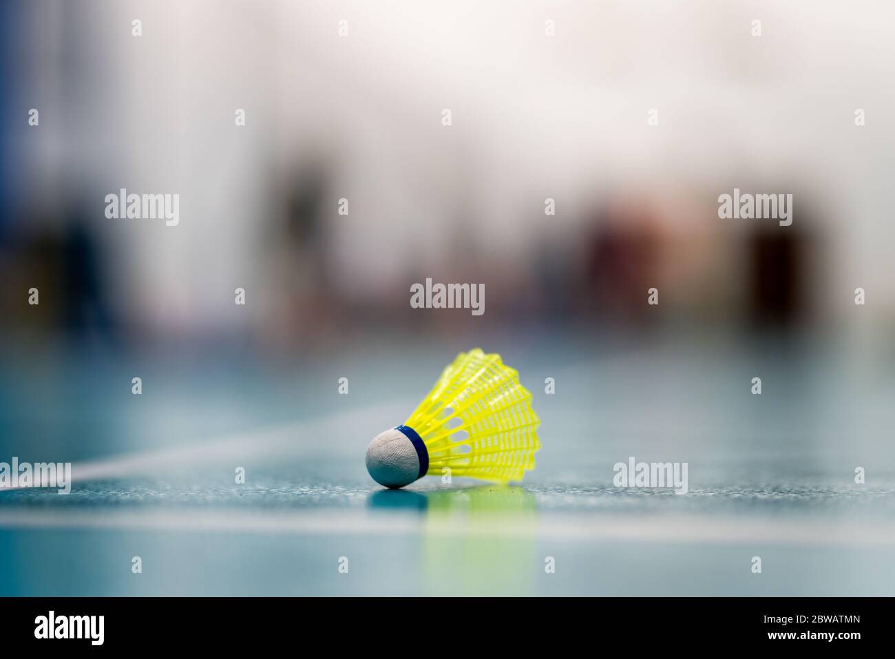 Badminton yellow shuttlecock on the green floor Stock Photo - Alamy