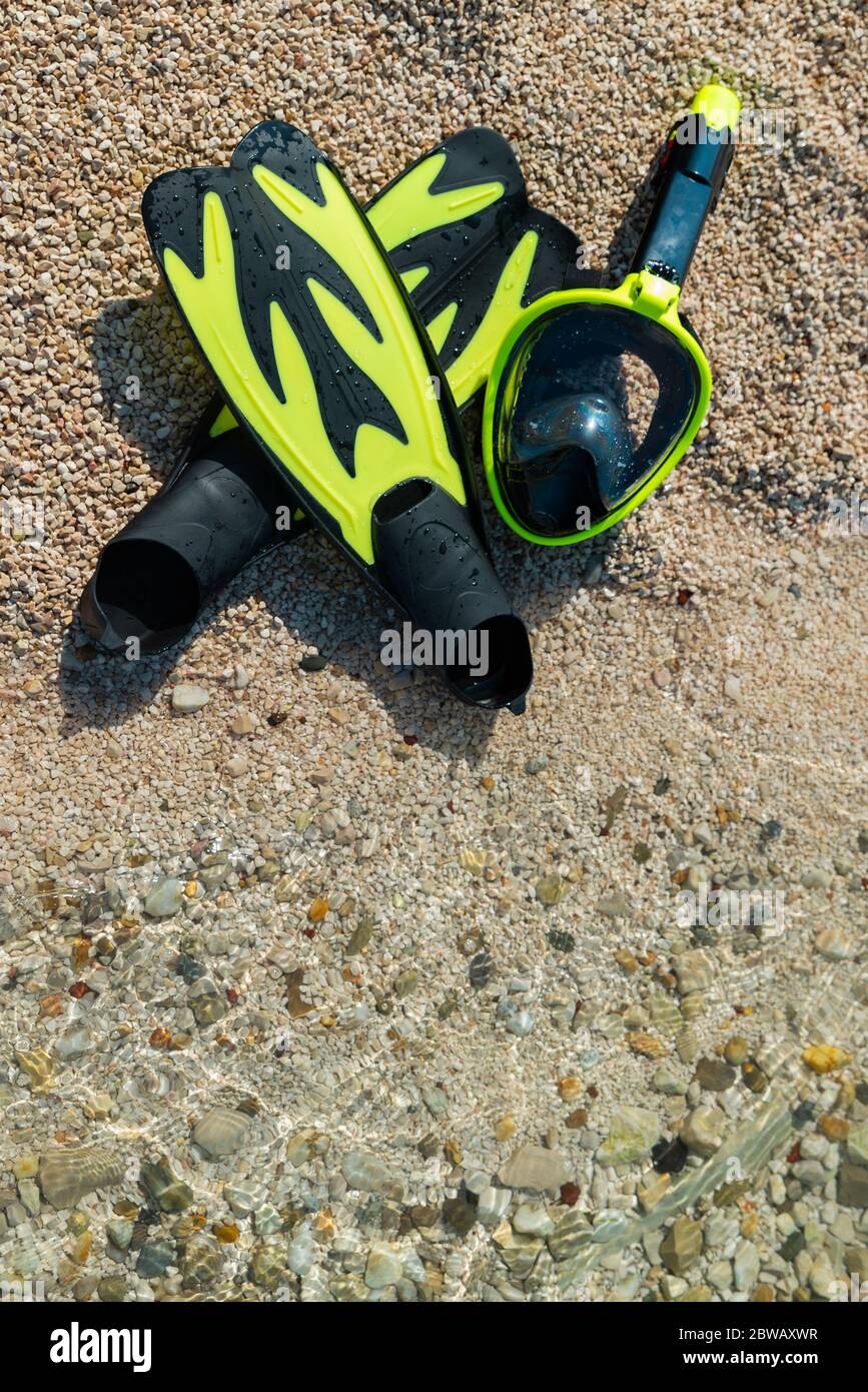 snorkeling mask with flippers at sea beach Stock Photo - Alamy