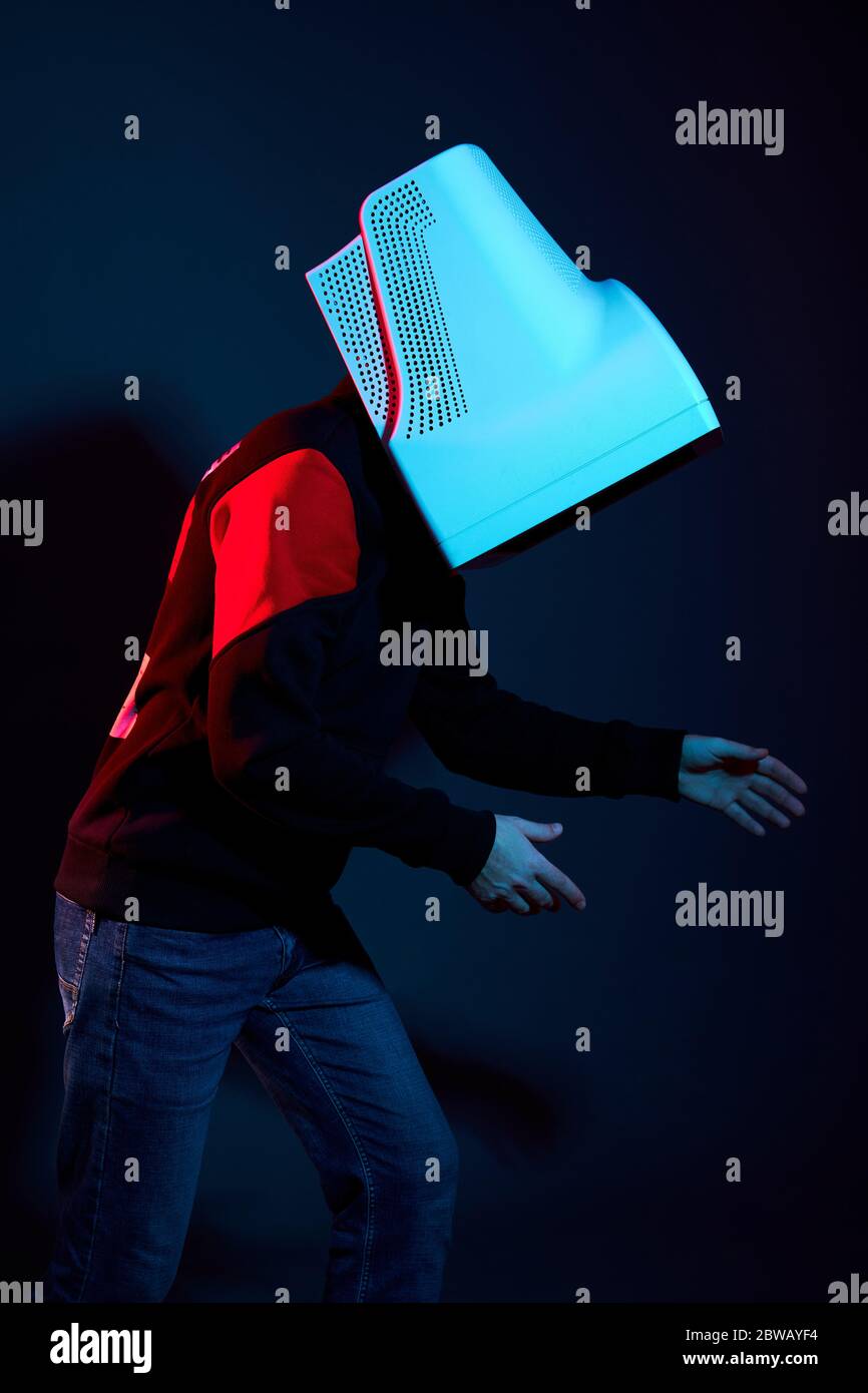 Man cyberpunk with a monitor instead of a head, computer addiction and ...