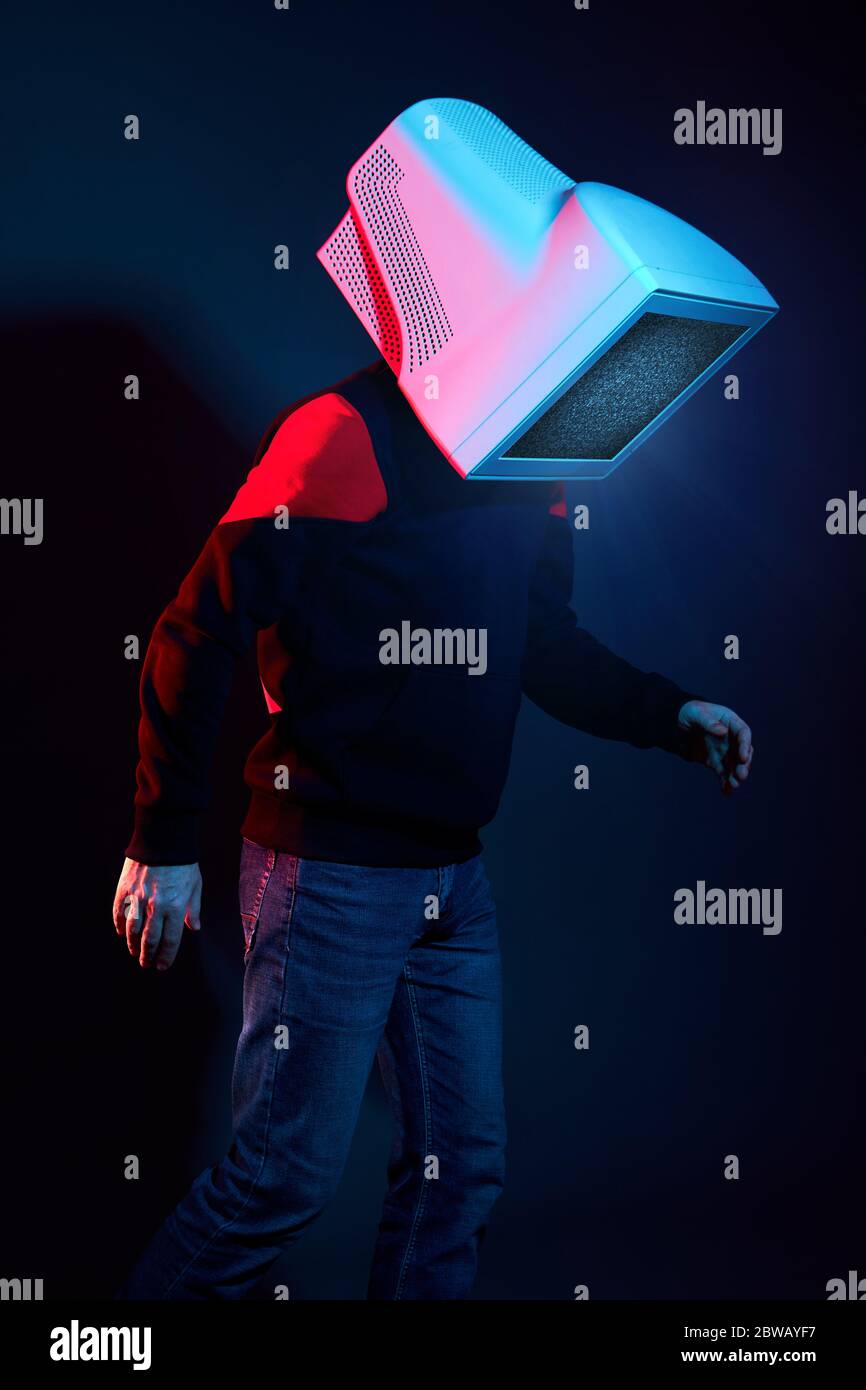 Man cyberpunk with a monitor instead of a head, computer addiction and ...