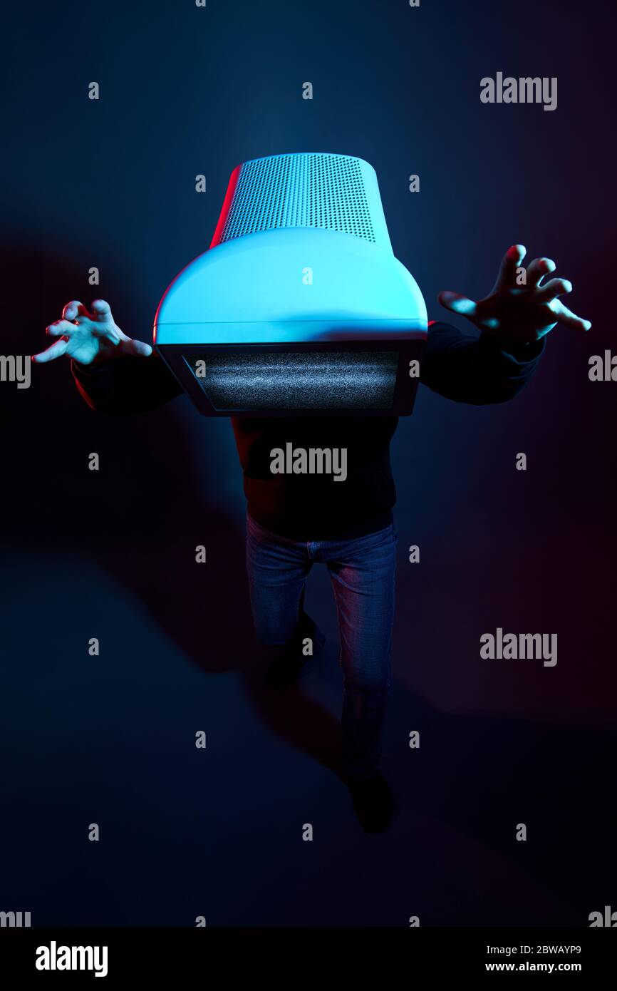 Man cyberpunk with a monitor instead of a head, computer addiction and ...