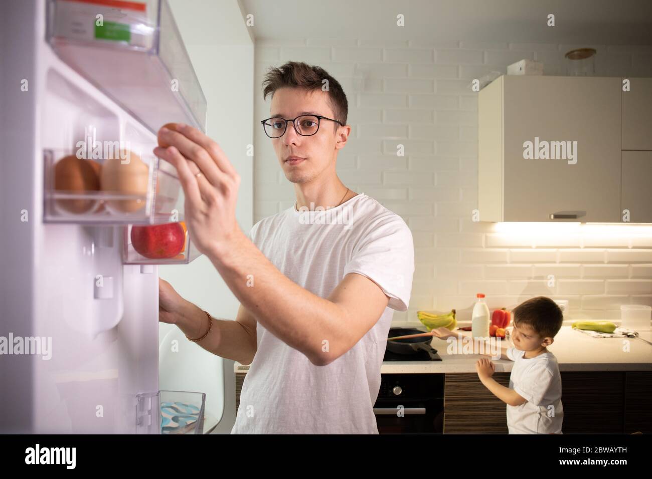 Camera Inside Kitchen Fridge: Man Opens Fridge Door, Looks inside Stock ...