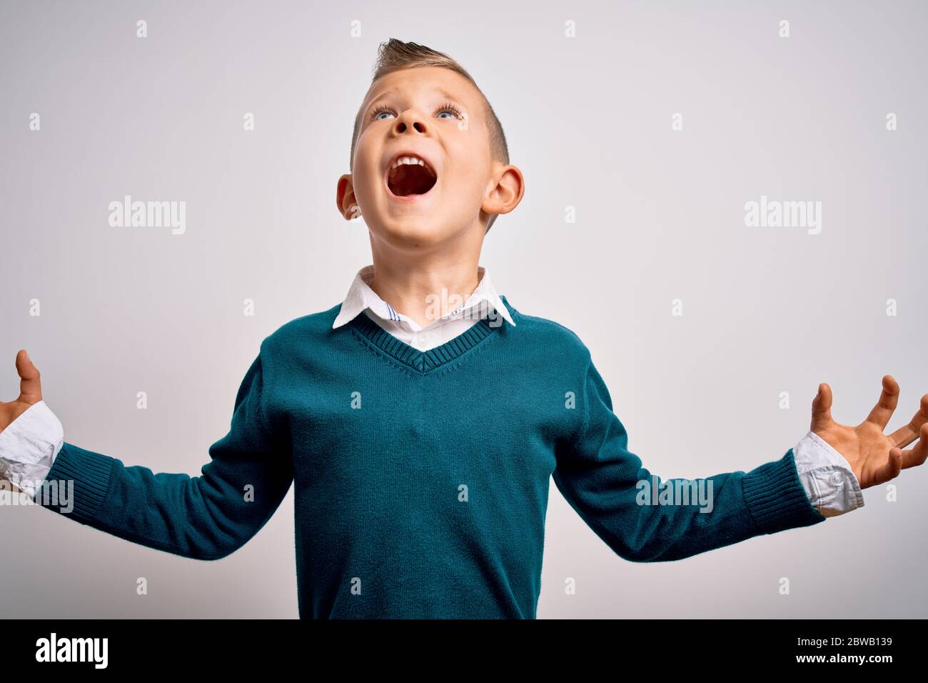 Young little caucasian kid with blue eyes standing wearing elegant ...