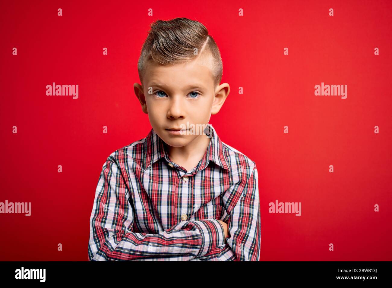 Young little caucasian kid with blue eyes standing wearing elegant ...