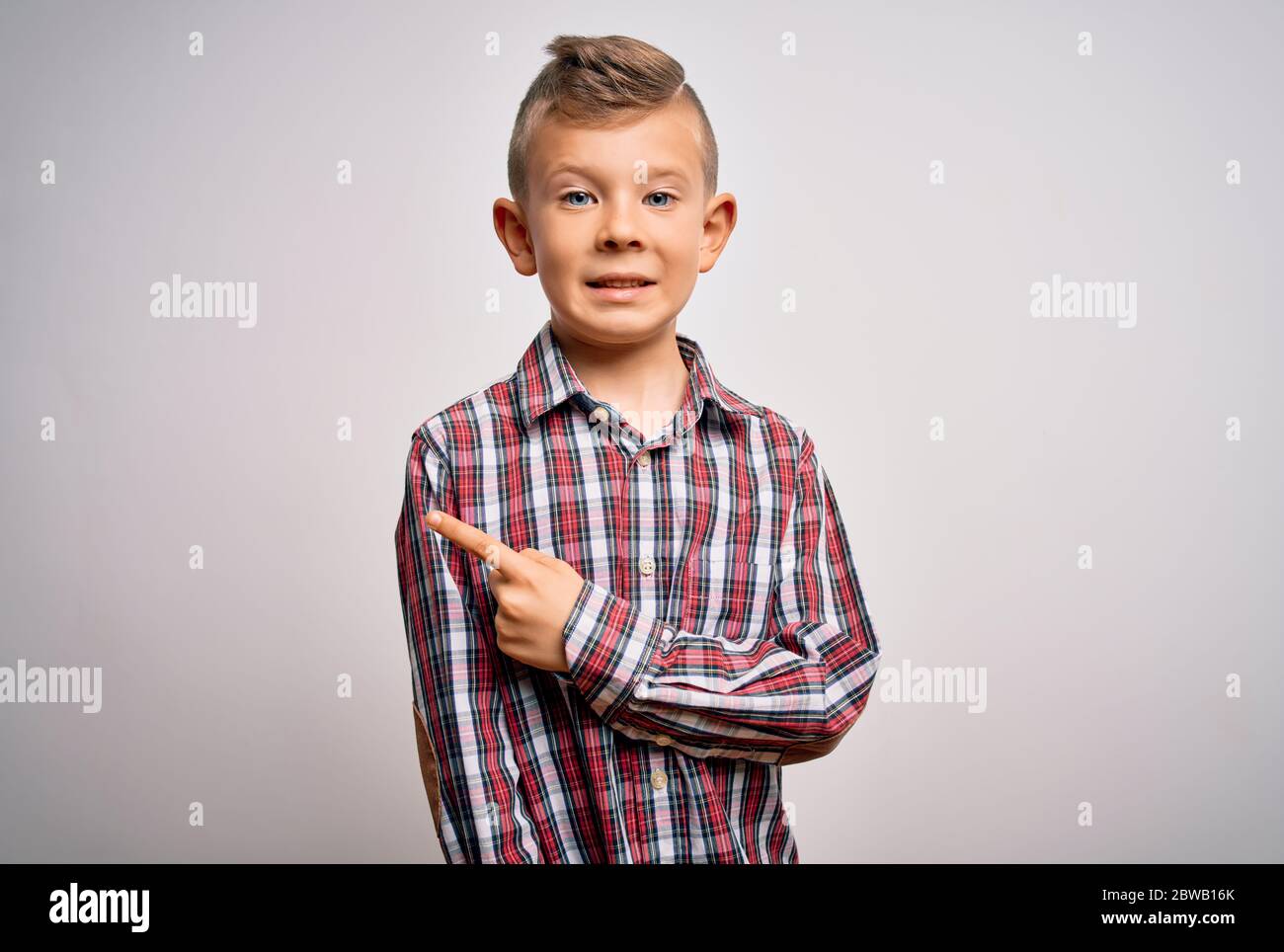 Young little caucasian kid with blue eyes wearing elegant shirt ...