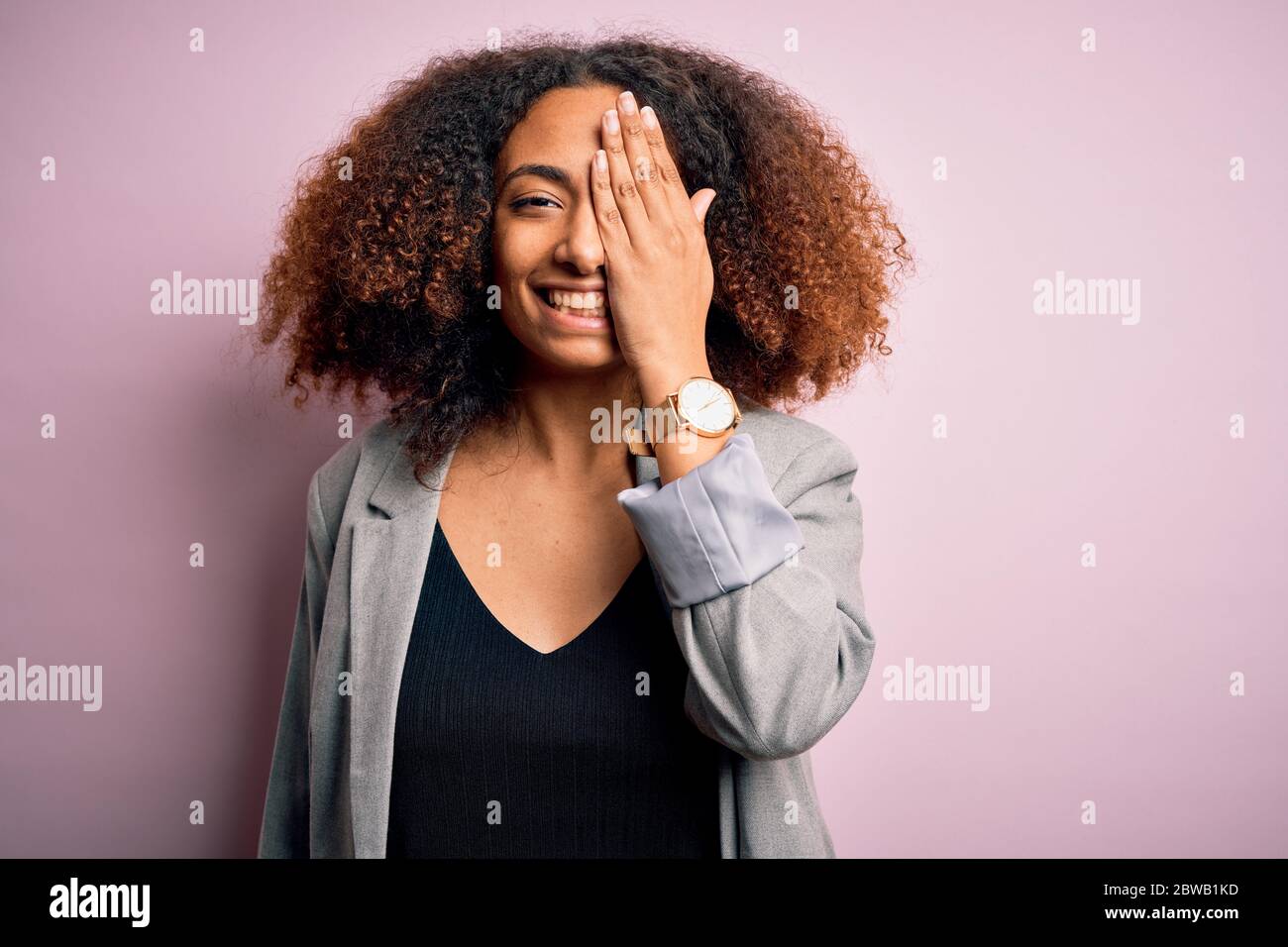 Young african american businesswoman with afro hair wearing elegant ...