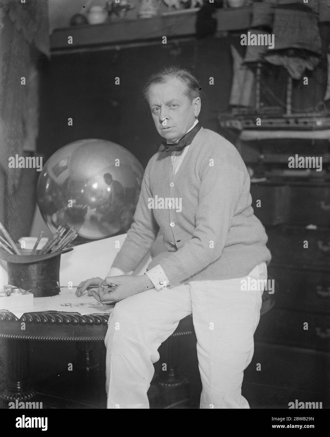 Dr William Nicholson , the painter designing costumes for ' Polly ...