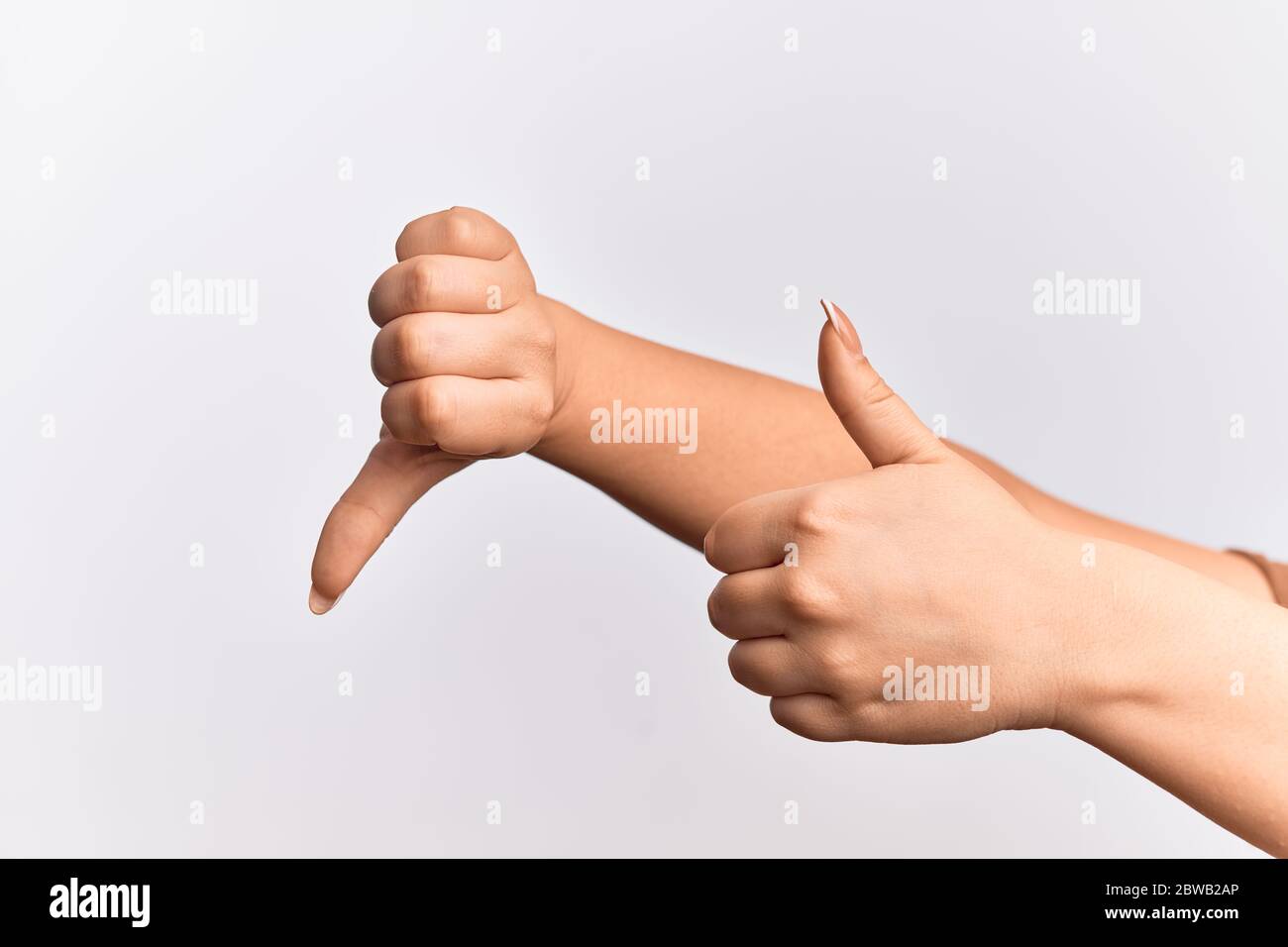 Hand of caucasian young woman showing disagree and agreement with ...