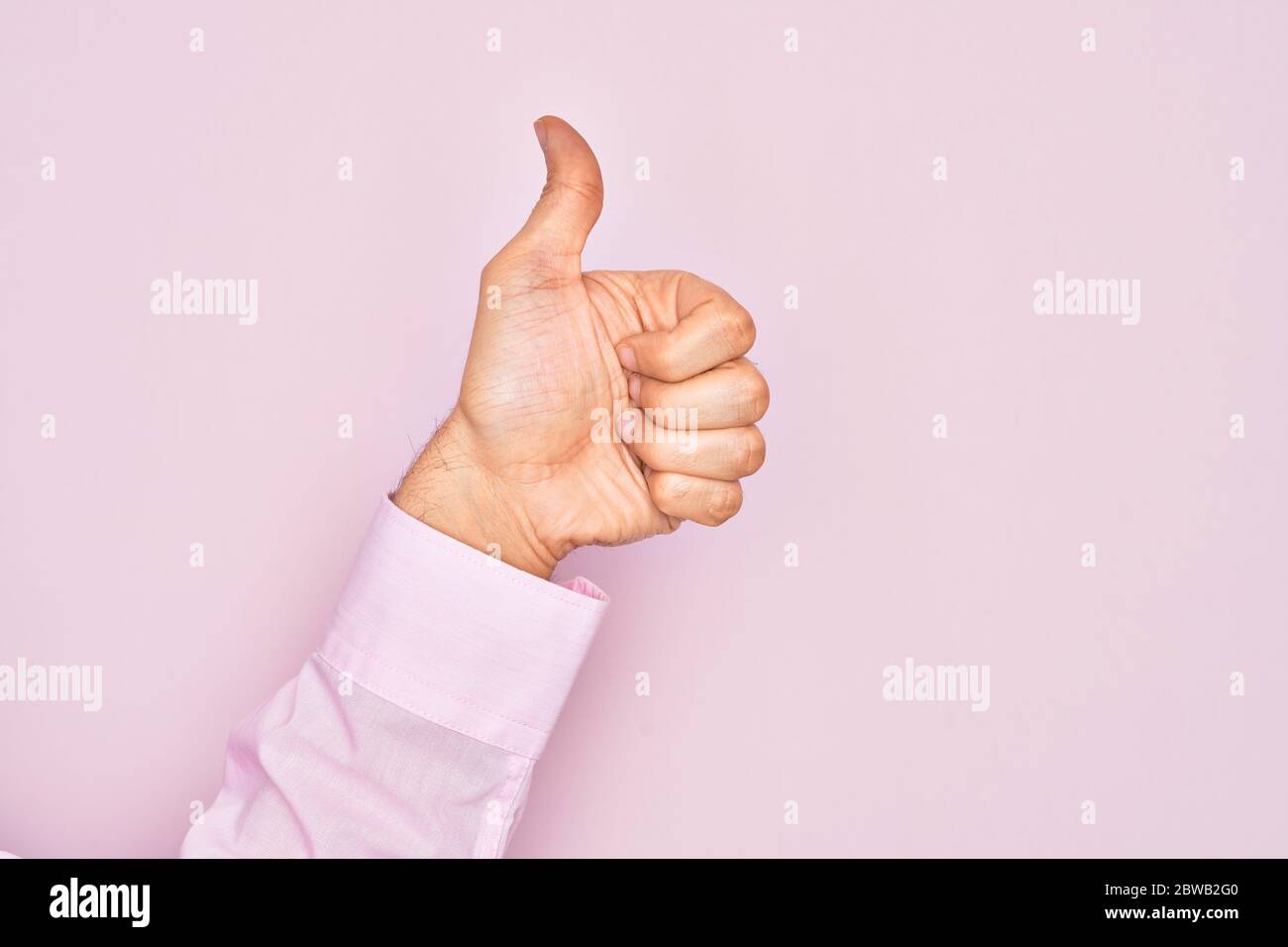 Hand of caucasian young man showing fingers over isolated pink ...