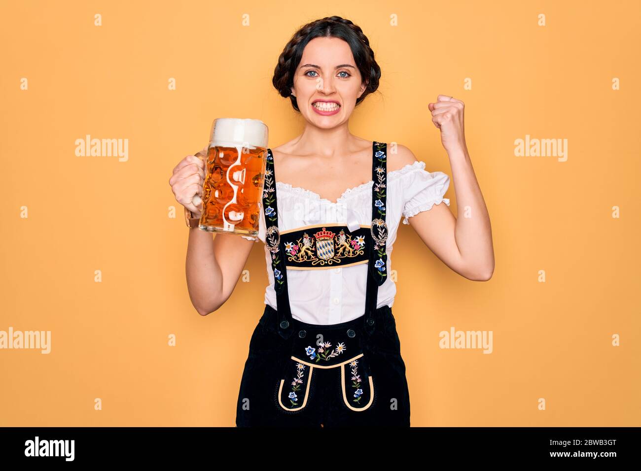 Beautiful german woman with blue eyes wearing traditional octoberfest ...