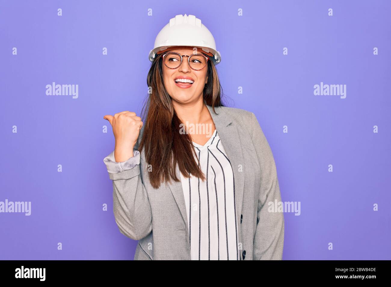 Professional woman engineer wearing industrial safety helmet over ...