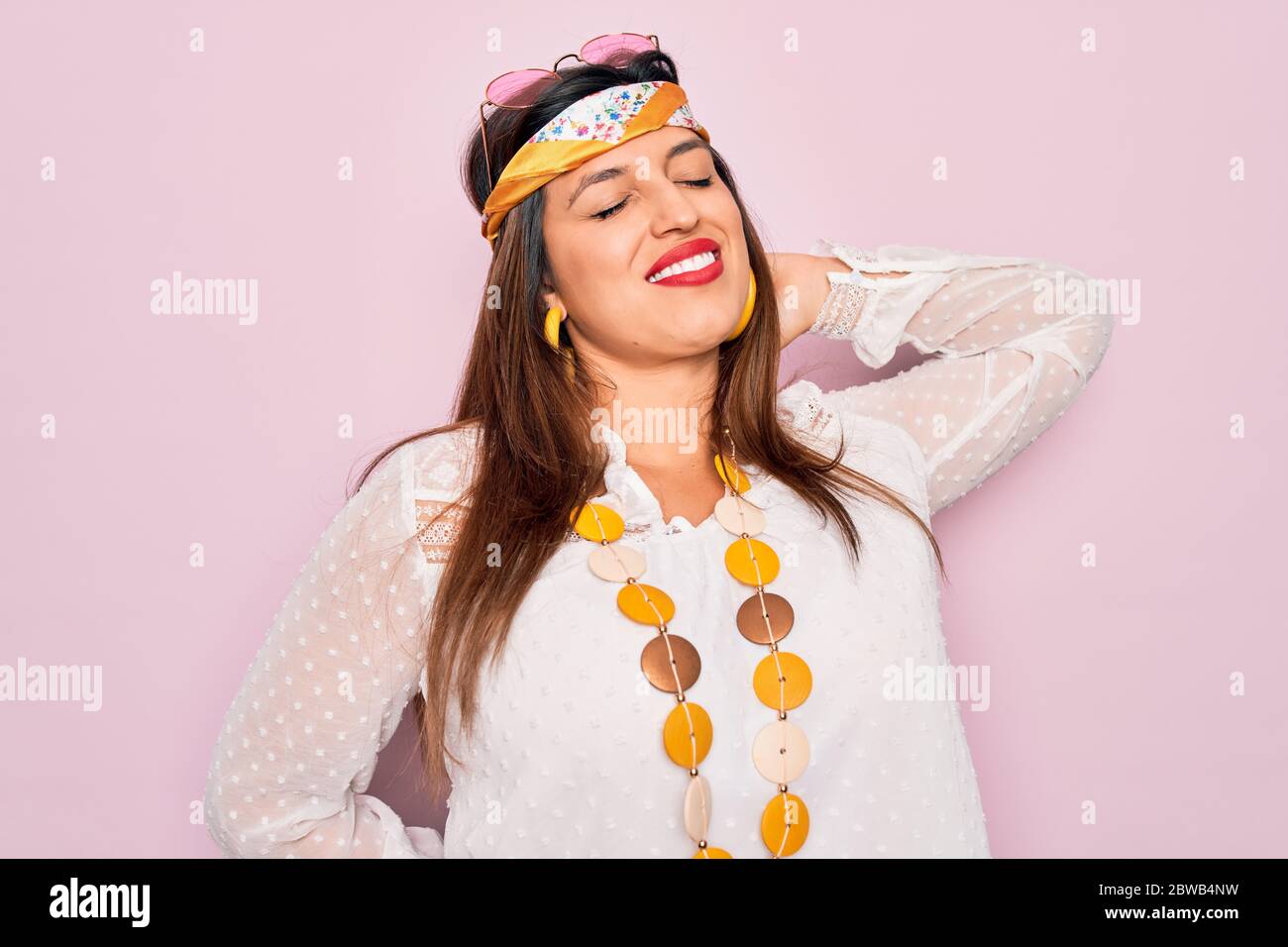Young hispanic hippie woman wearing fashion boho style and sunglasses ...