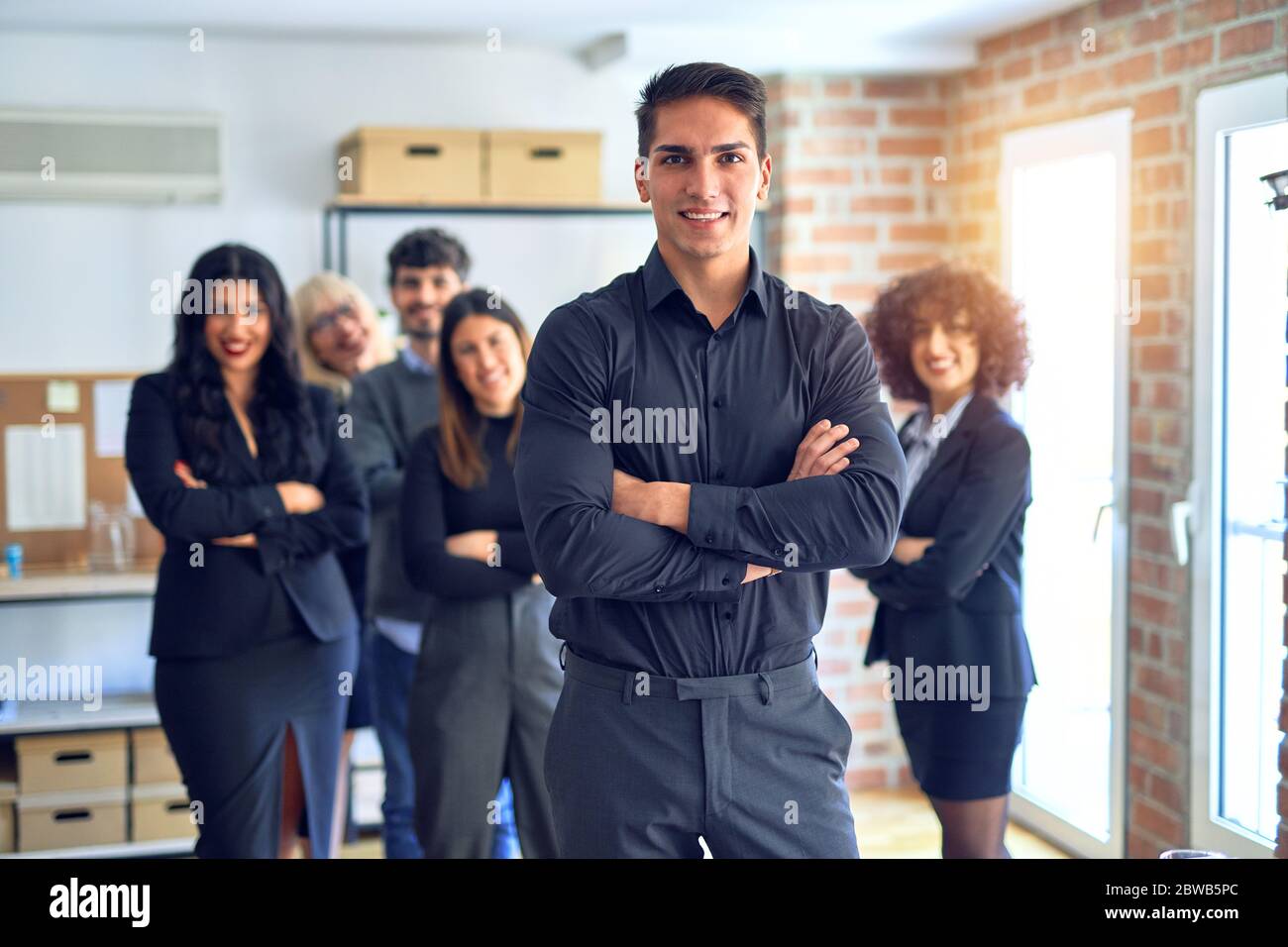 Group of business workers smiling happy and confident. Posing together ...