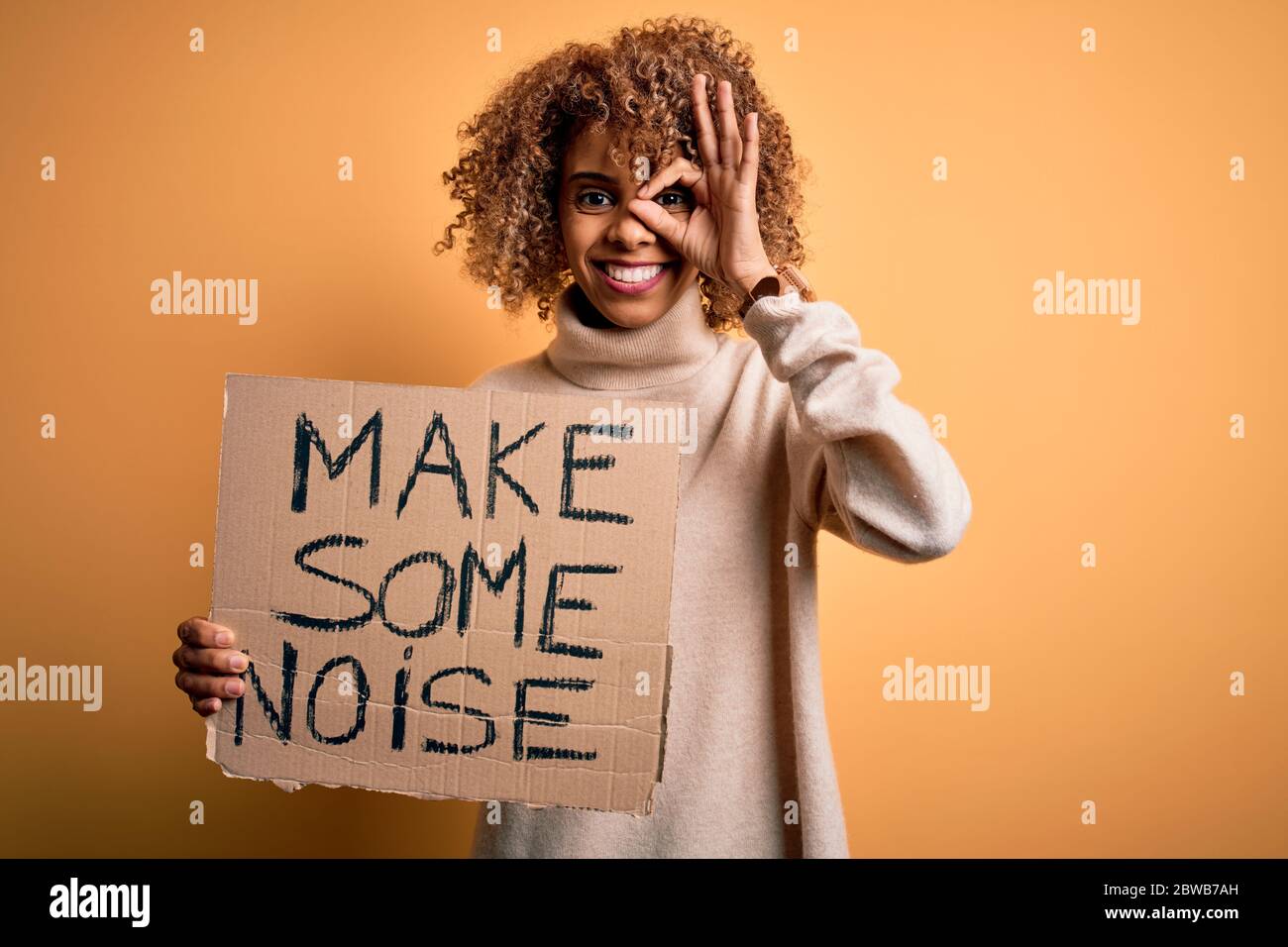 African american activist woman asking for revolution holding banner ...