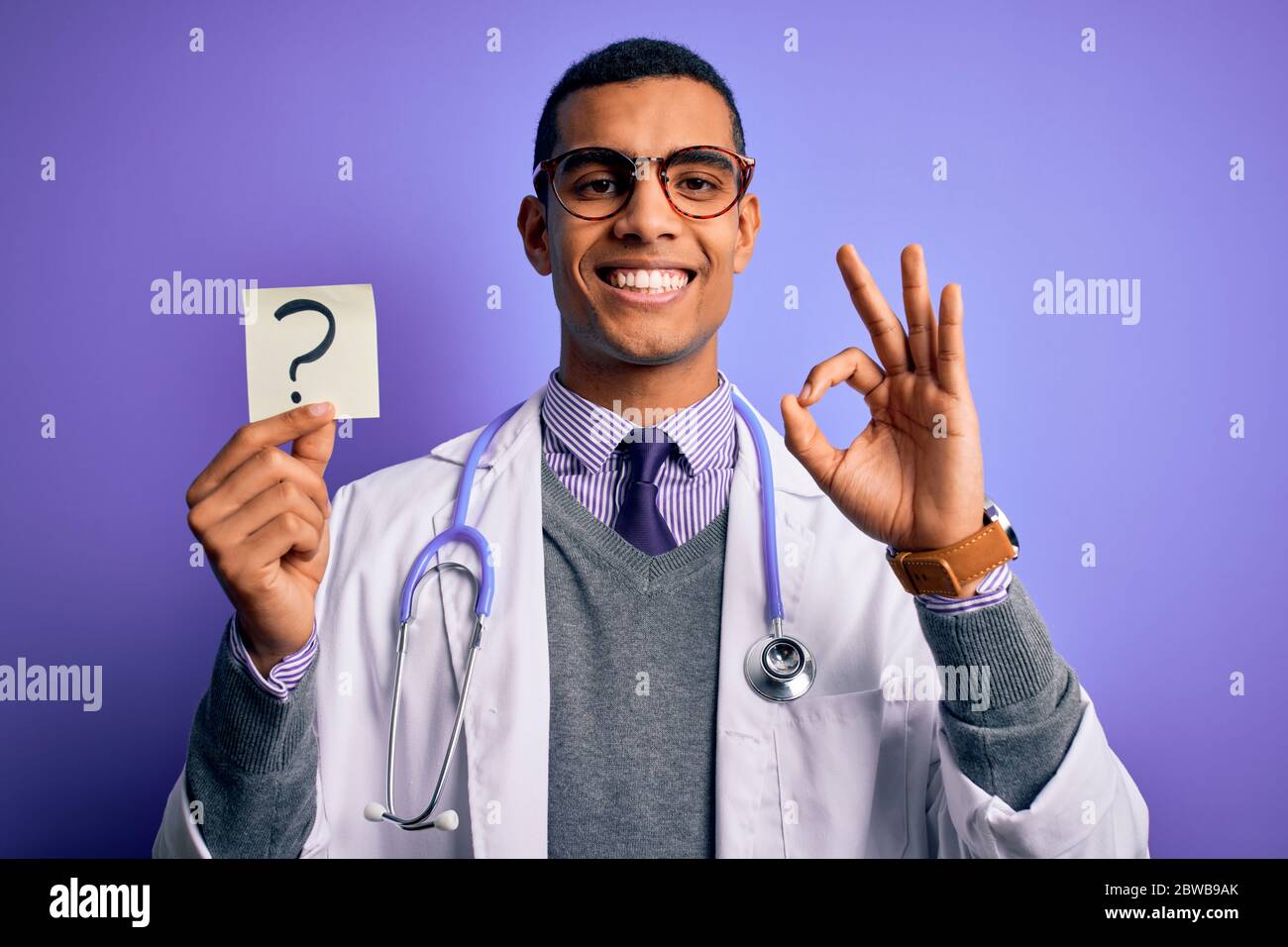 Handsome african american doctor man wearing stethoscope holding ...