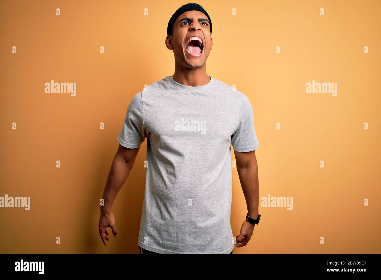 Handsome african american sportsman doing sport wearing sportswear over ...