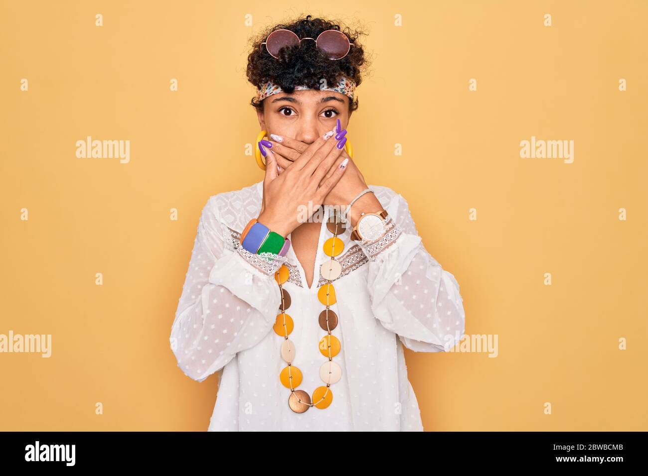 Young beautiful african american afro hippie woman wearing sunglasses ...