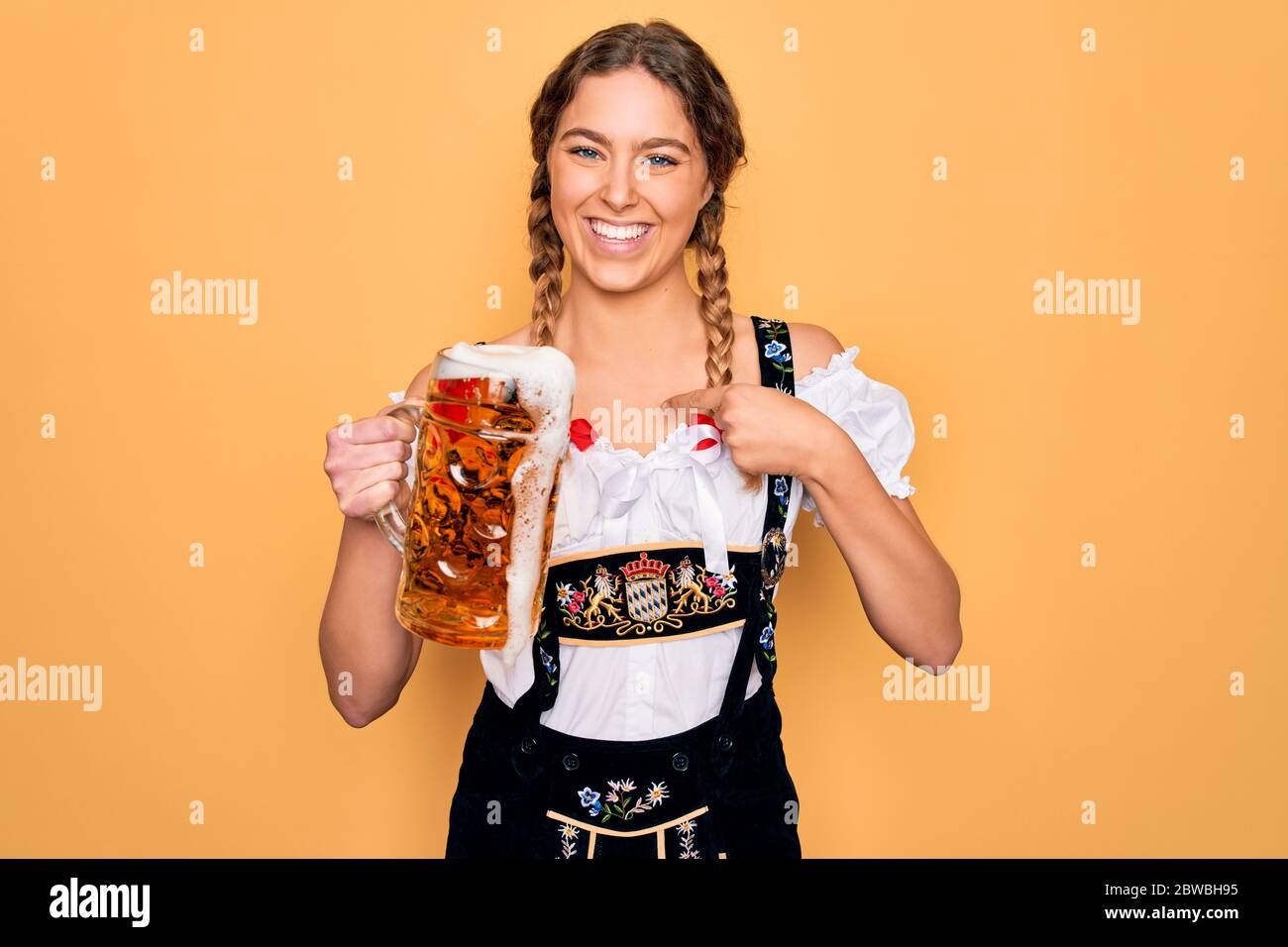 Beautiful blonde german woman with blue eyes wearing octoberfest dress ...