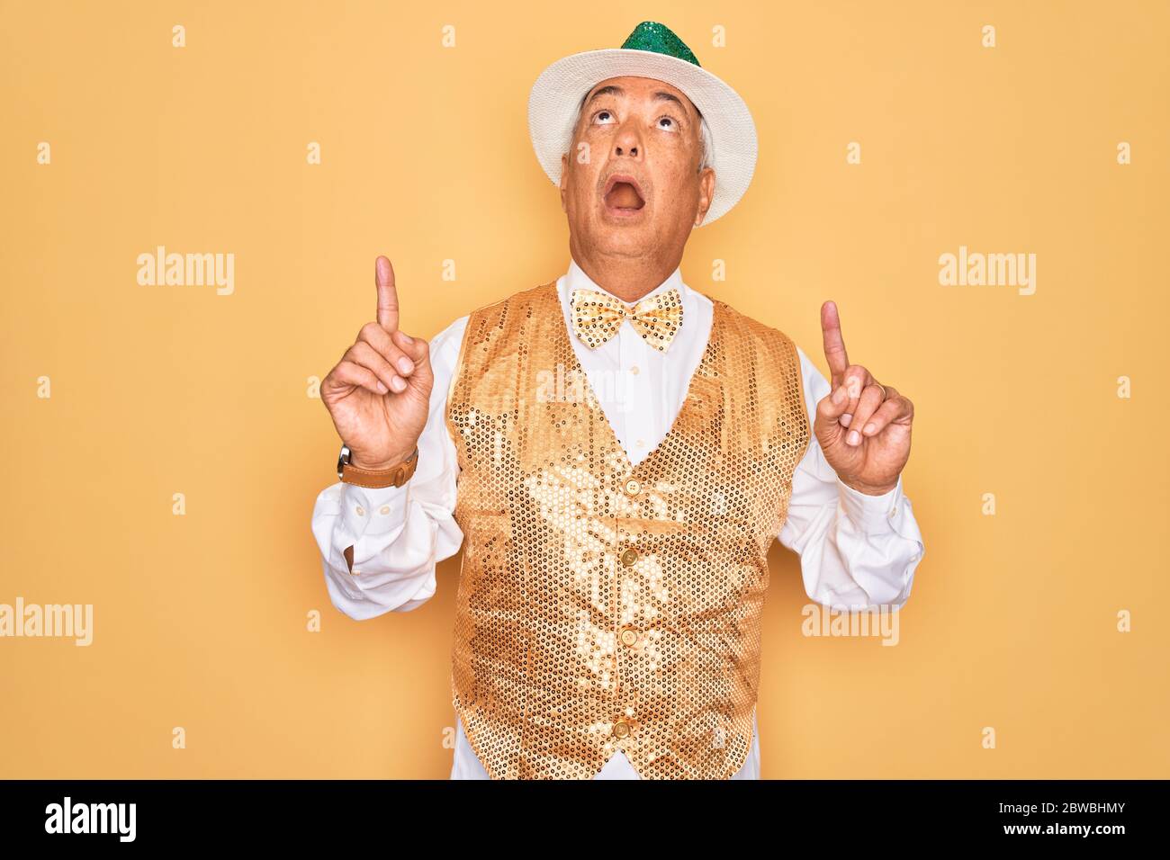 Middle age senior grey-haired man wearing Brazilian carnival custome ...