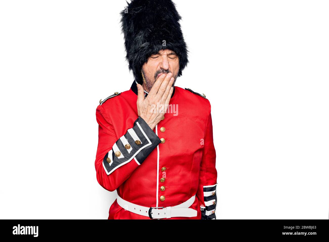 Middle age handsome wales guard man wearing traditional uniform over ...