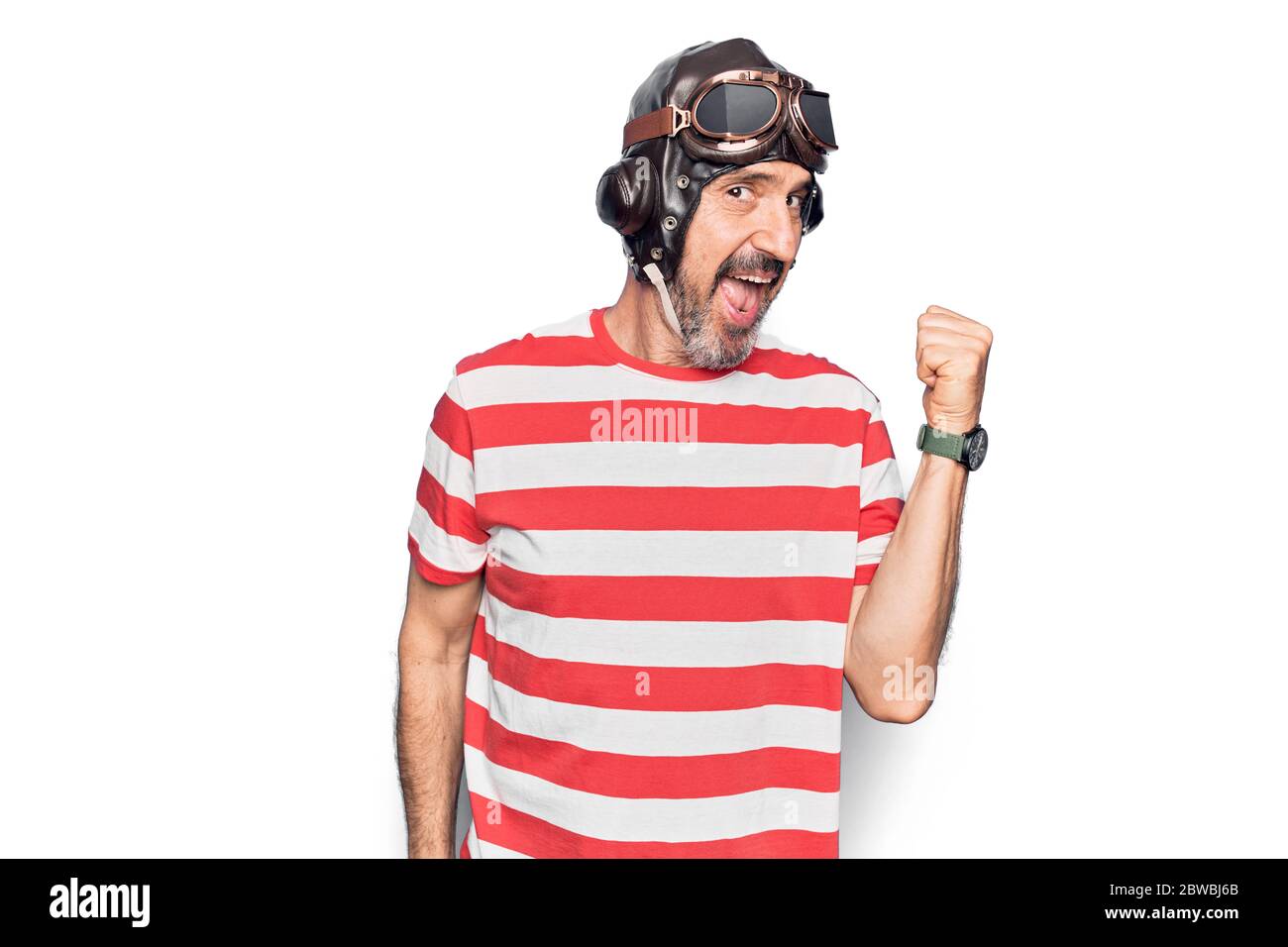 Middle age aviator man wearing vintage helmet and glasses over isolated ...