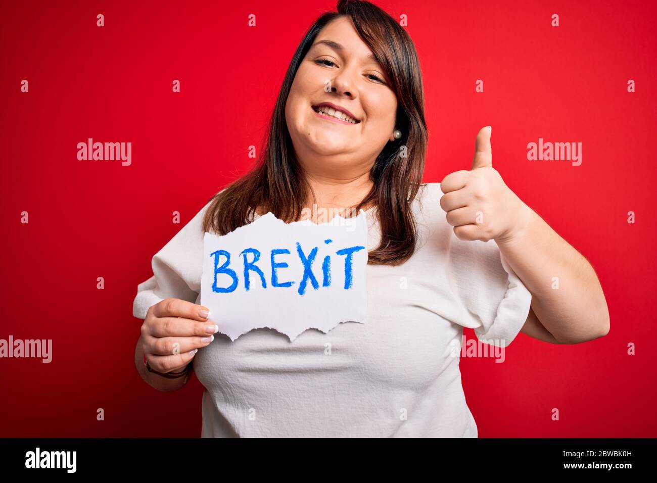 Beautiful plus size woman holding brexit banner for political ...