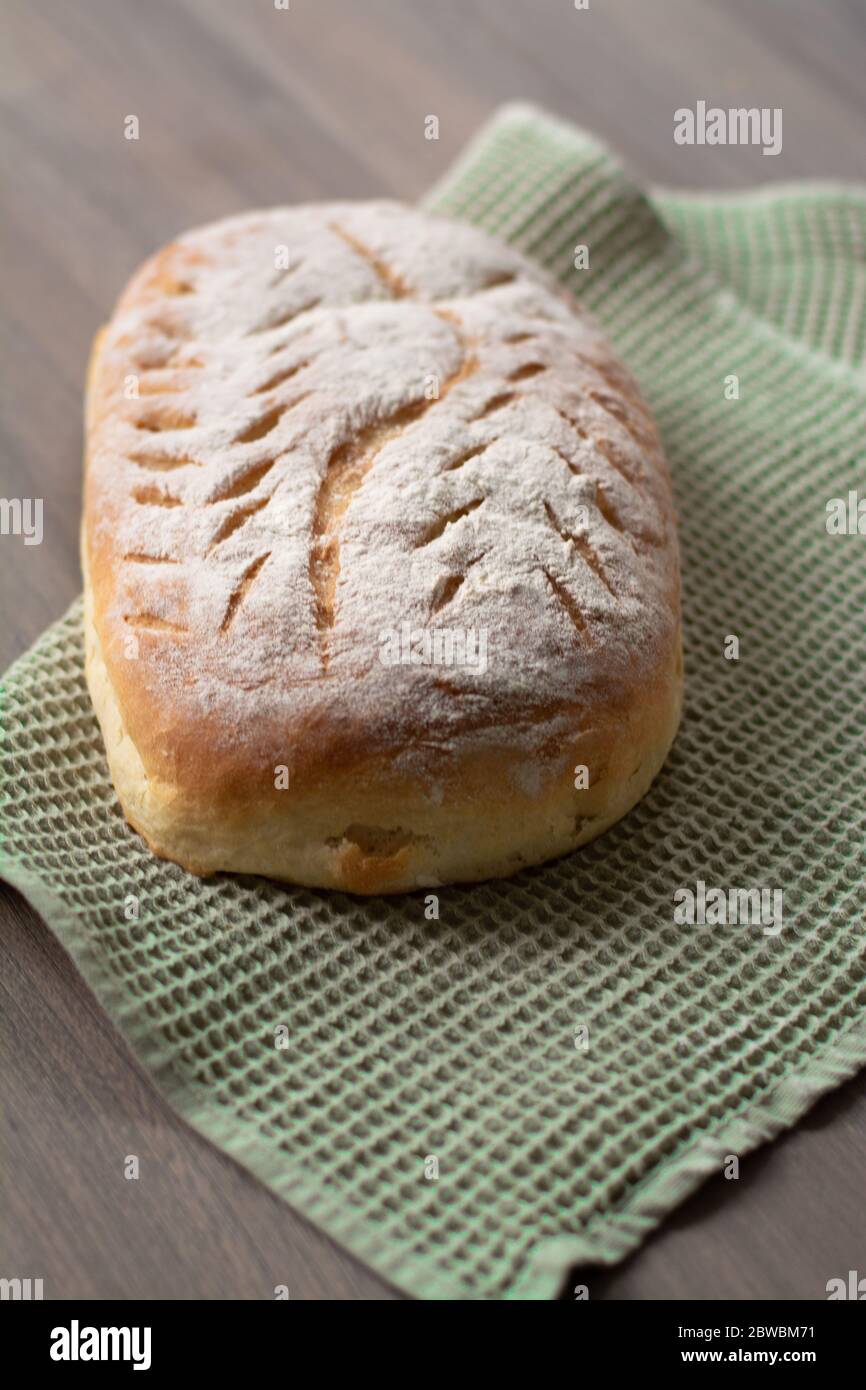 Homemade artisan sourdough bread loaf with artistic leaf pattern ...