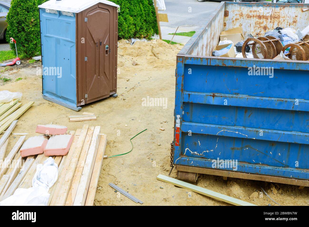 Portable restroom on house under construction in a dumpsters ...