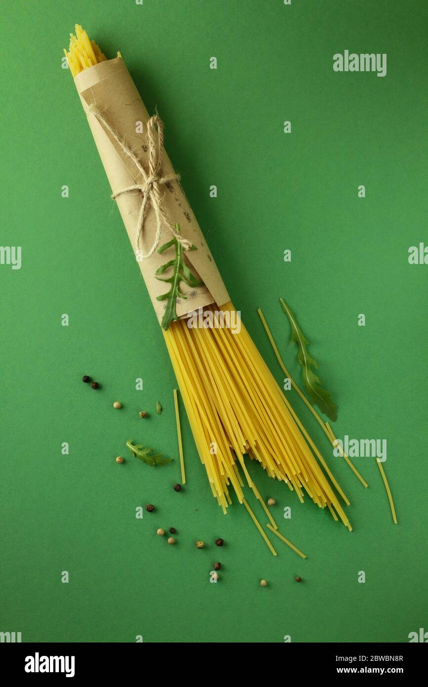 Bunch of dry spaghetti pasta with fresh spices, herbs and peppers ...