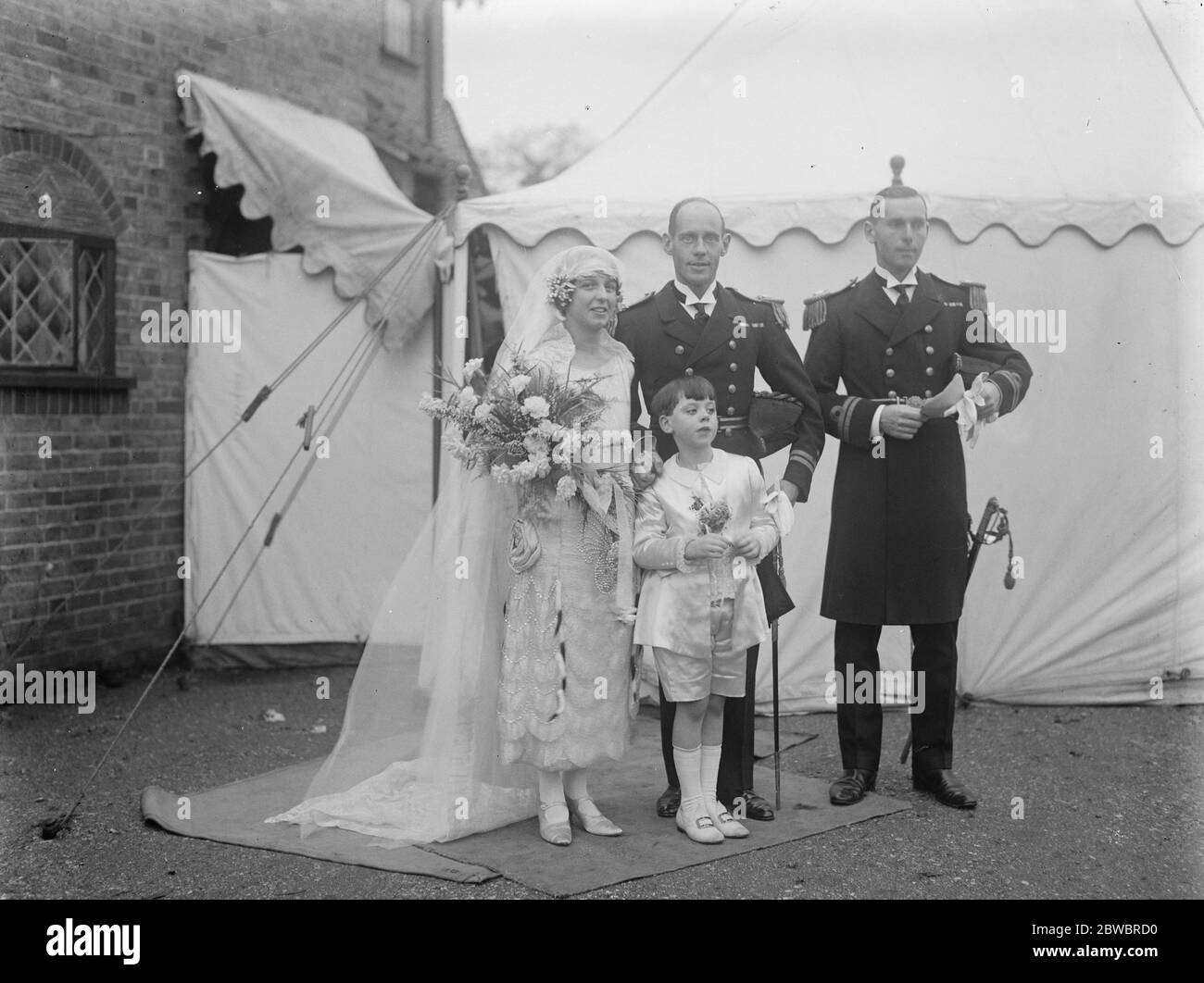 Naval Lieutenant weds Rear Admiral 's daughter . The marriage arranged ...