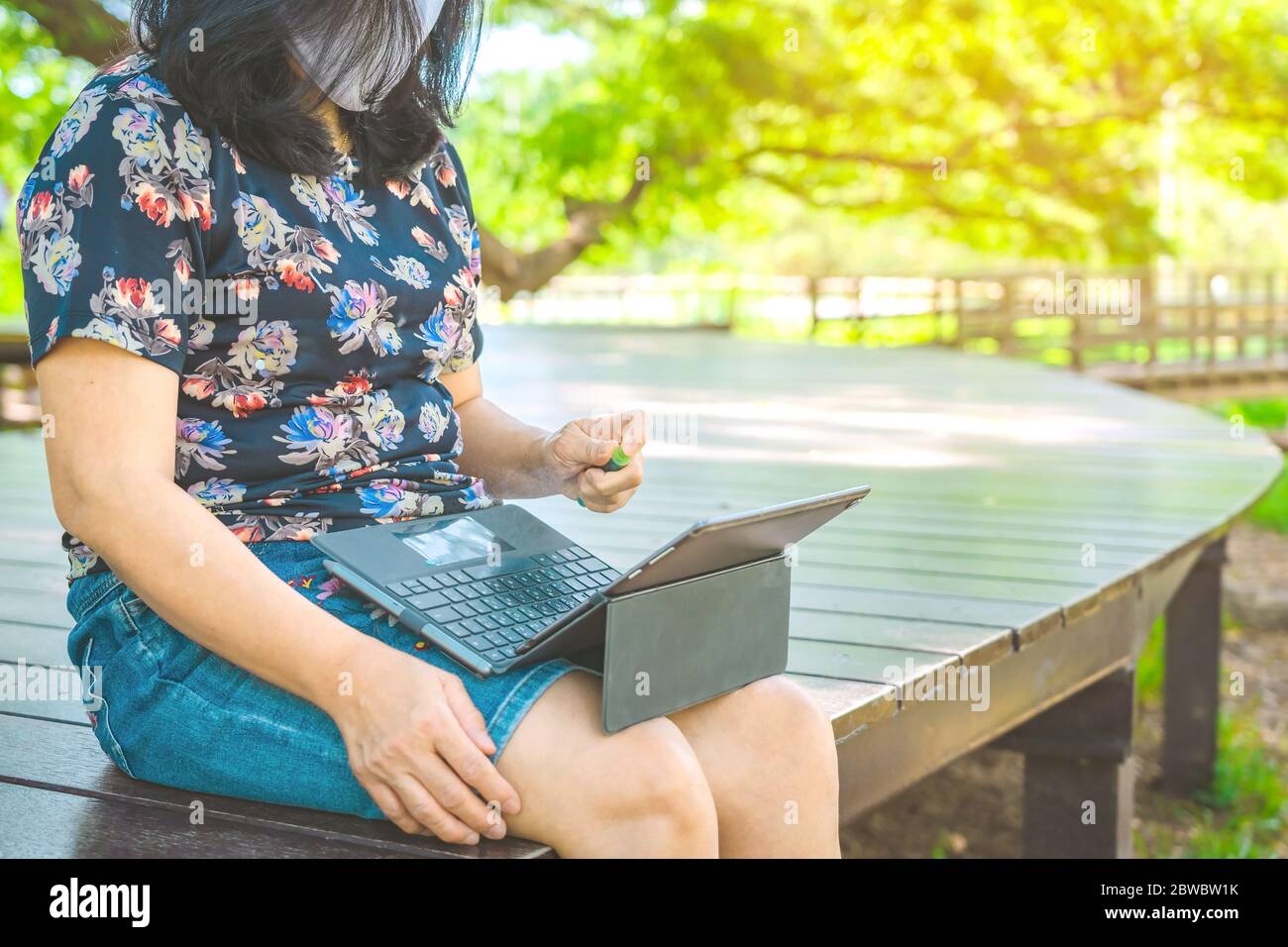 Using disinfectant spray clean laptop hi-res stock photography and ...