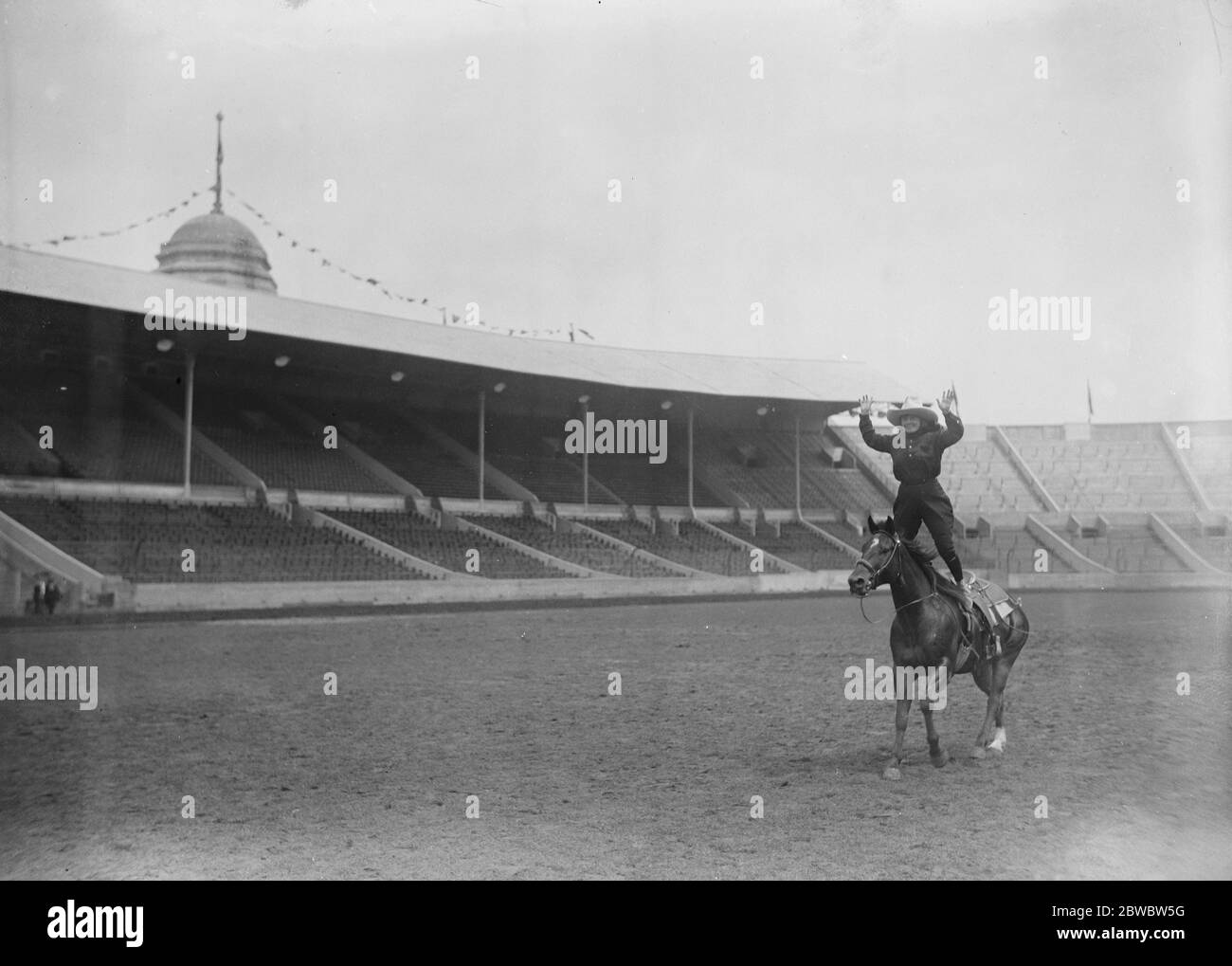 International rodeo starts at Wembley . A cowgirl gives an exhibition ...